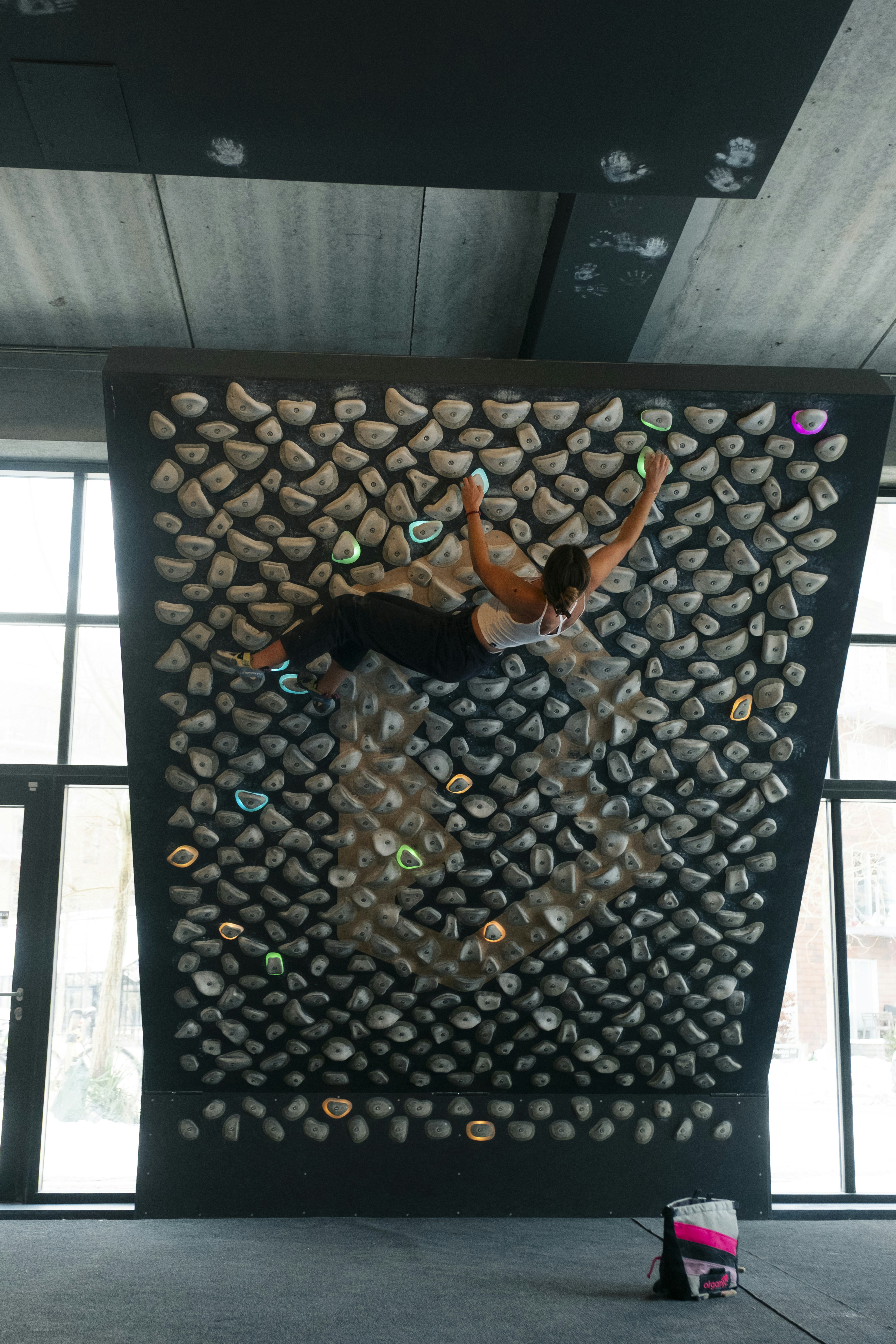 Climber in the Rock Wall Arch: A Dynamic Ascent Inside a Modern Exhibit