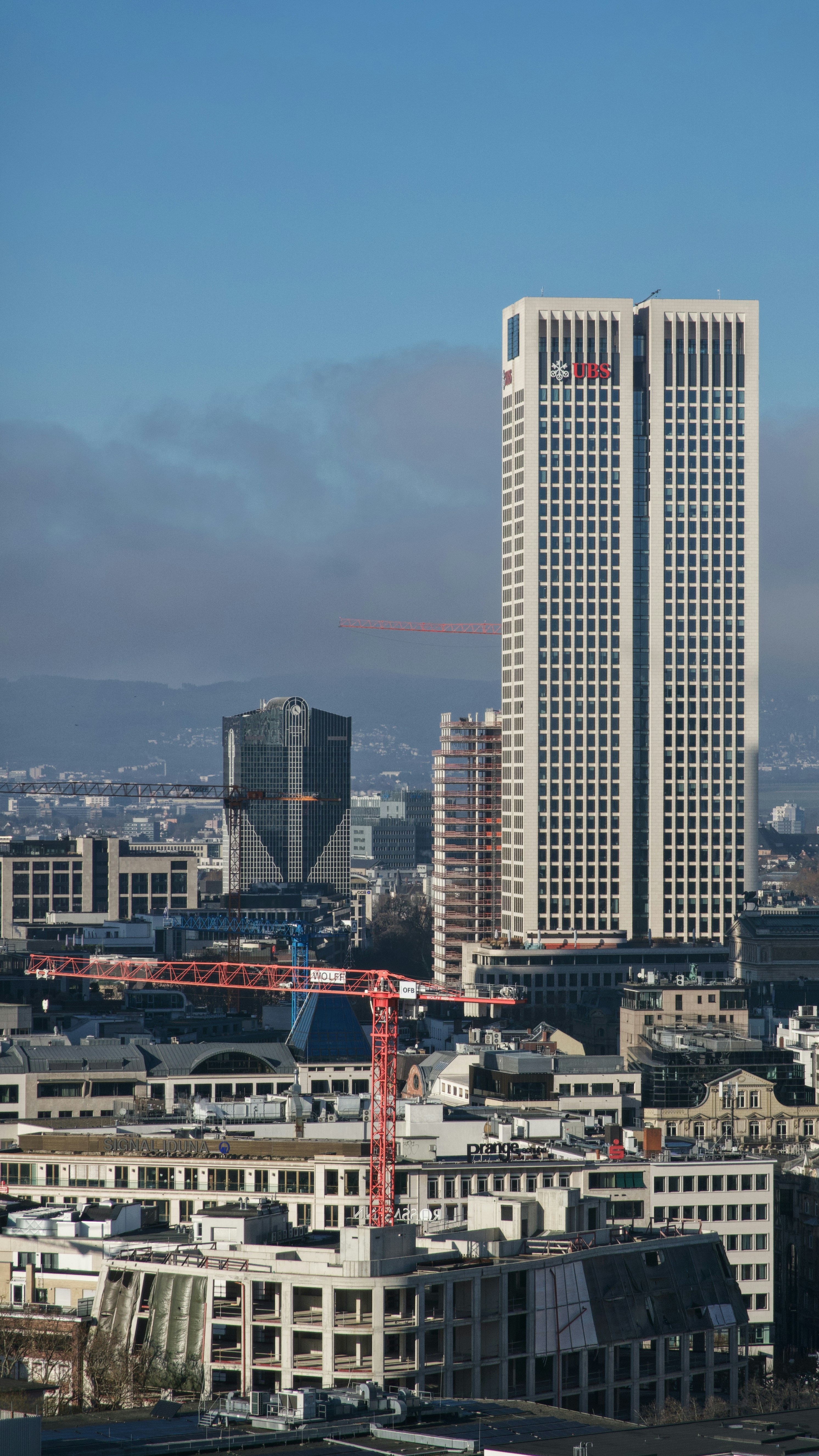Blue Sky, Towering Ambitions: A Downtown Skyline Under Construction