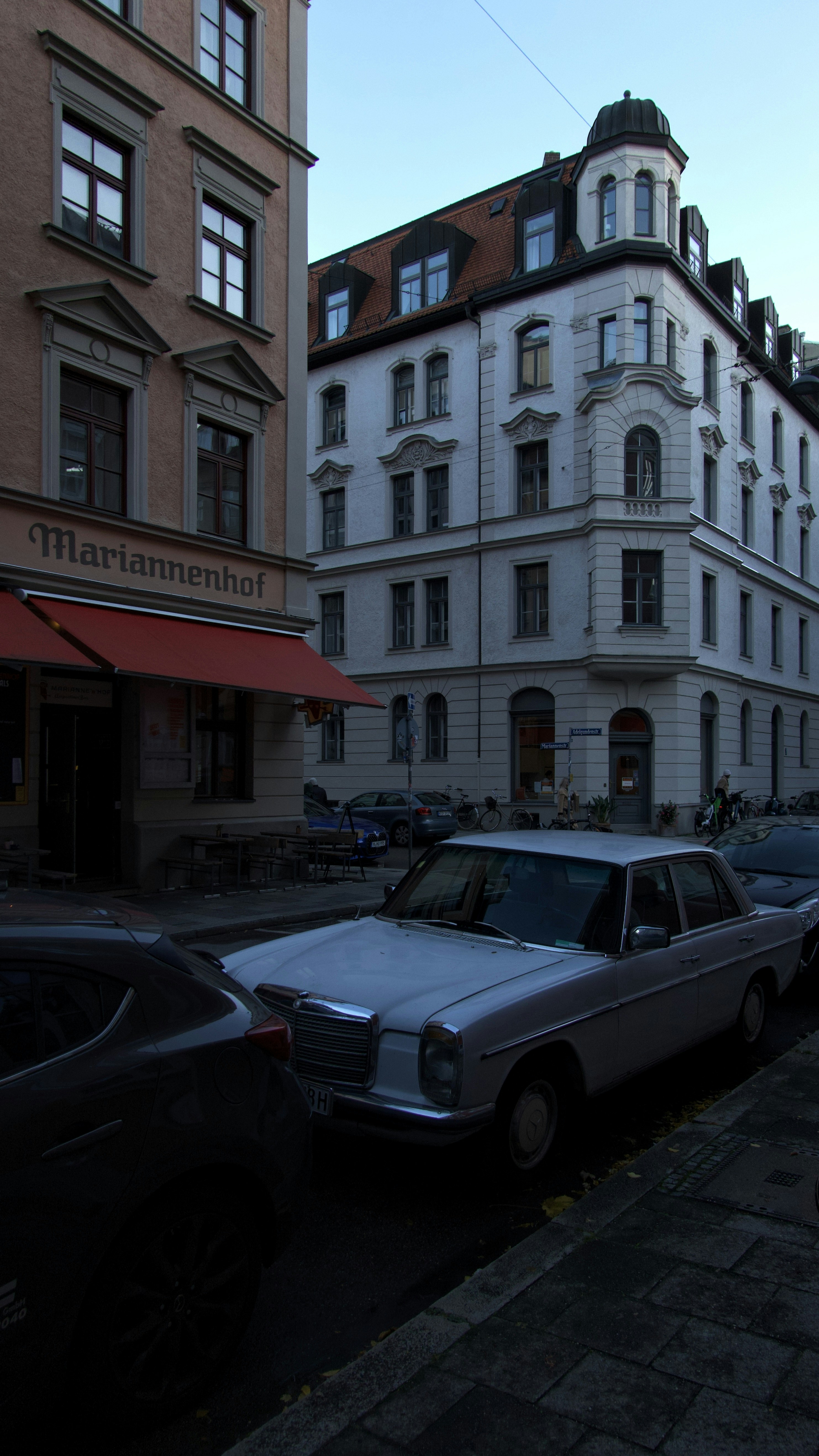 Classic European Street Scene with Vintage Car and Historic Architecture