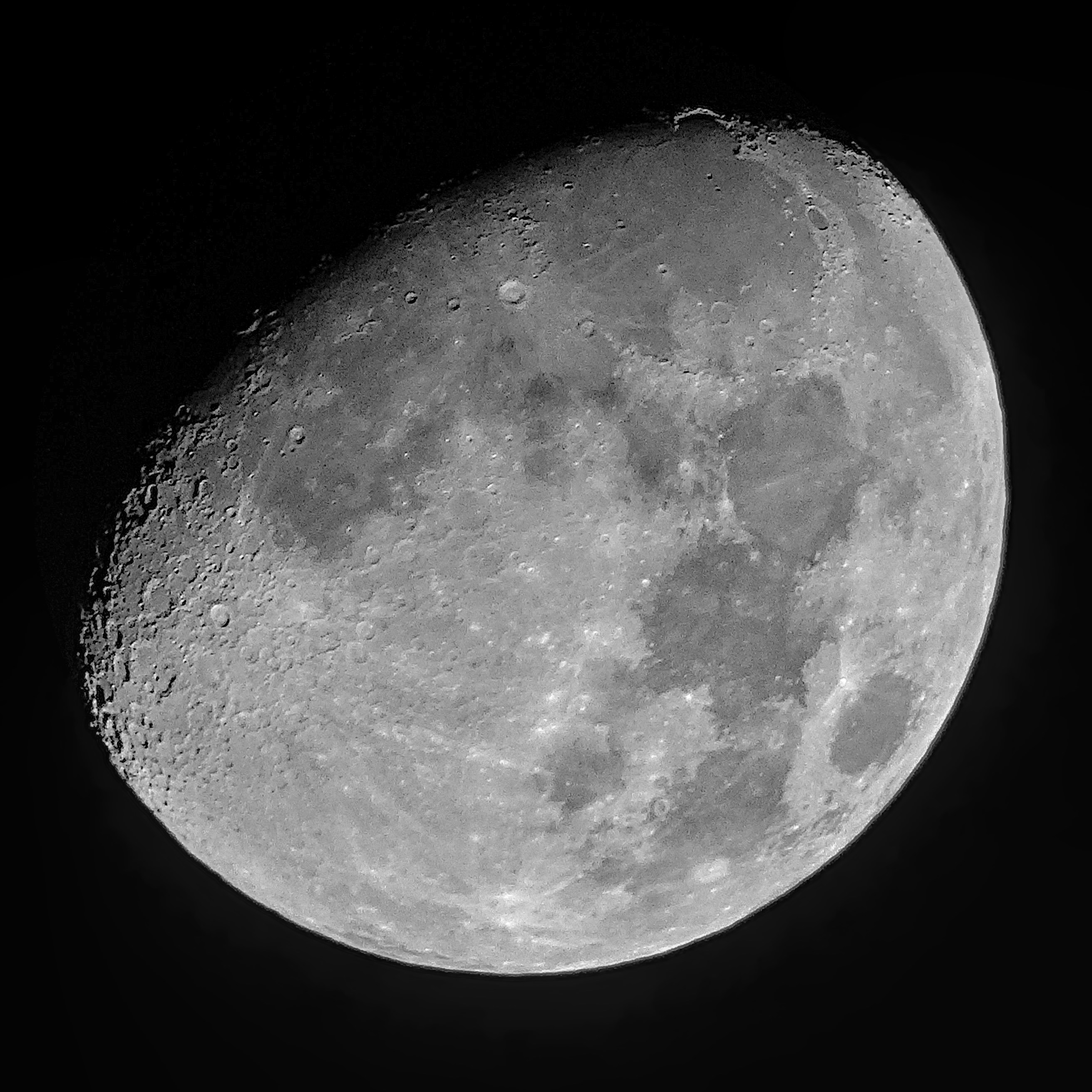 Crescent Moon Revealed: A detailed, grayscale lunar portrait