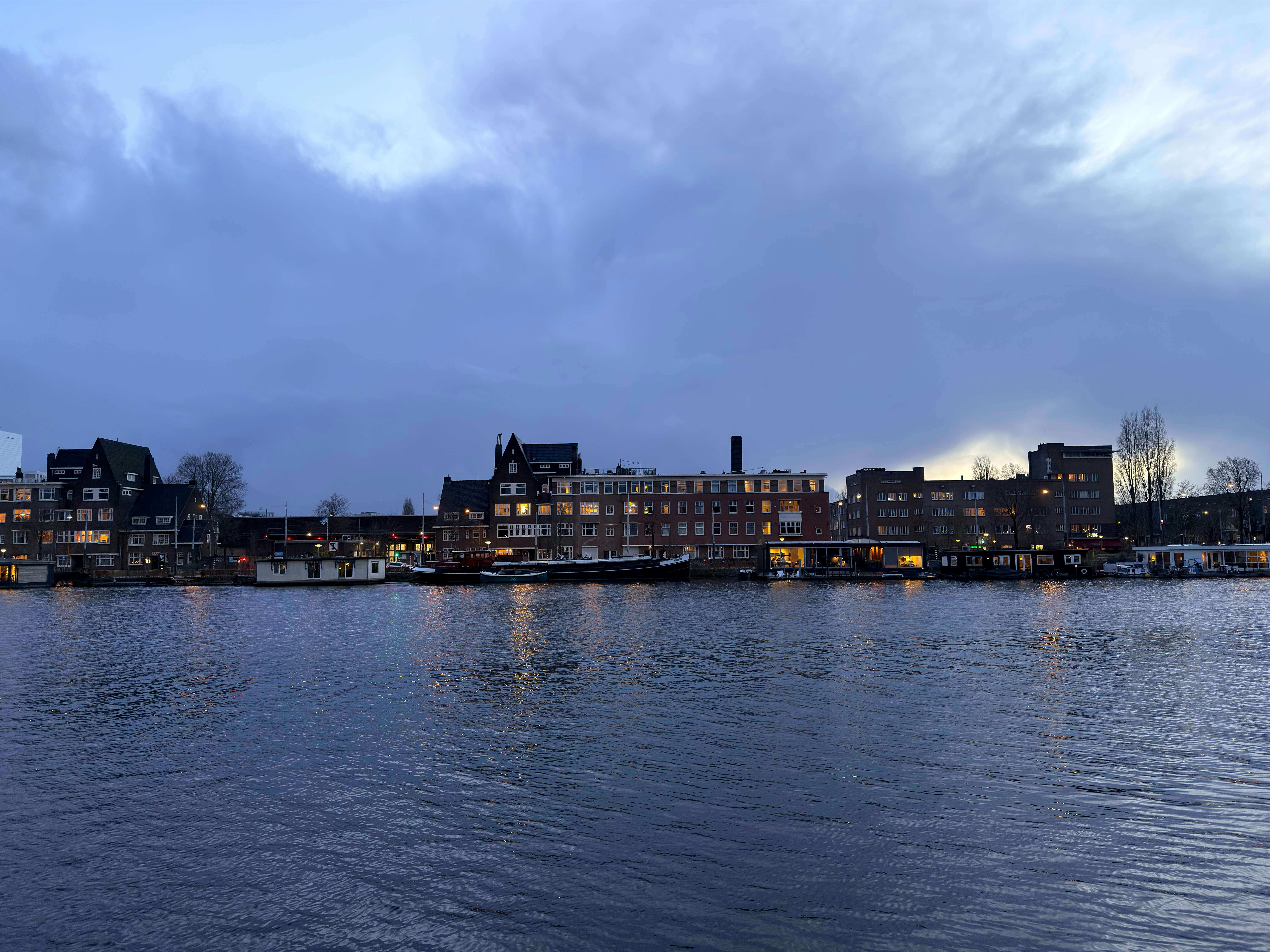 Waterside Town at Dusk: Echoes of Light on the Waterfront