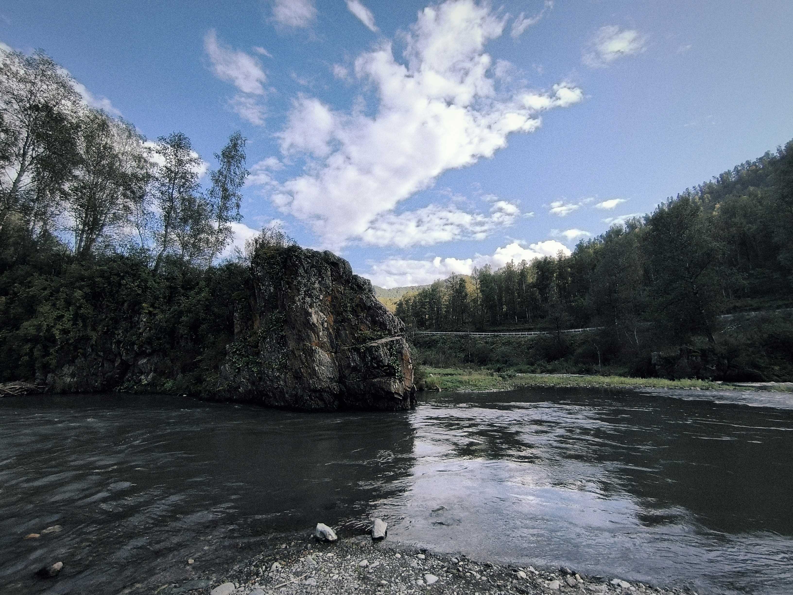 River Gorge Beneath a Sky-Willed Cliff