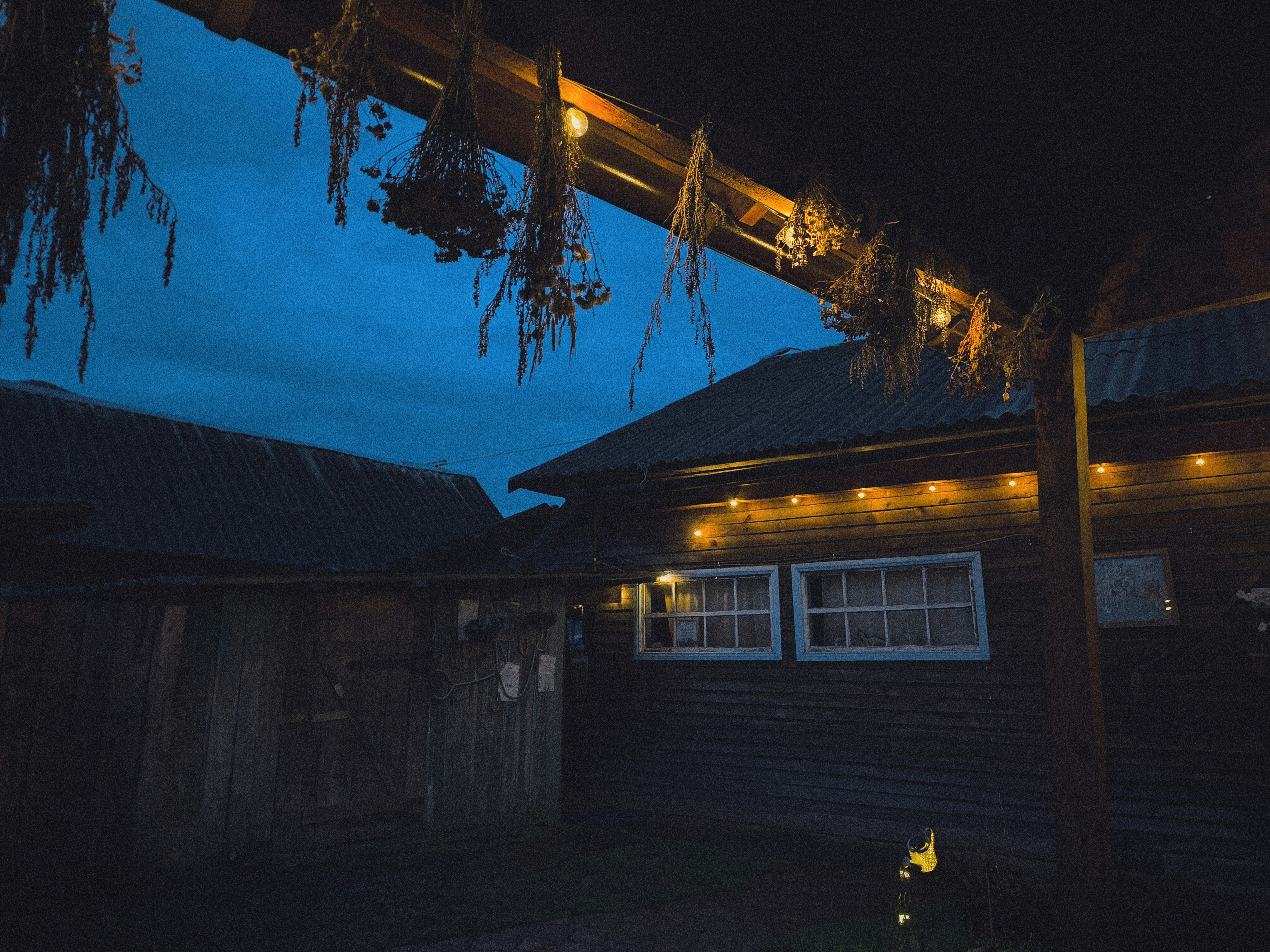 Blue Hour Courtyard Under Warm Eaves