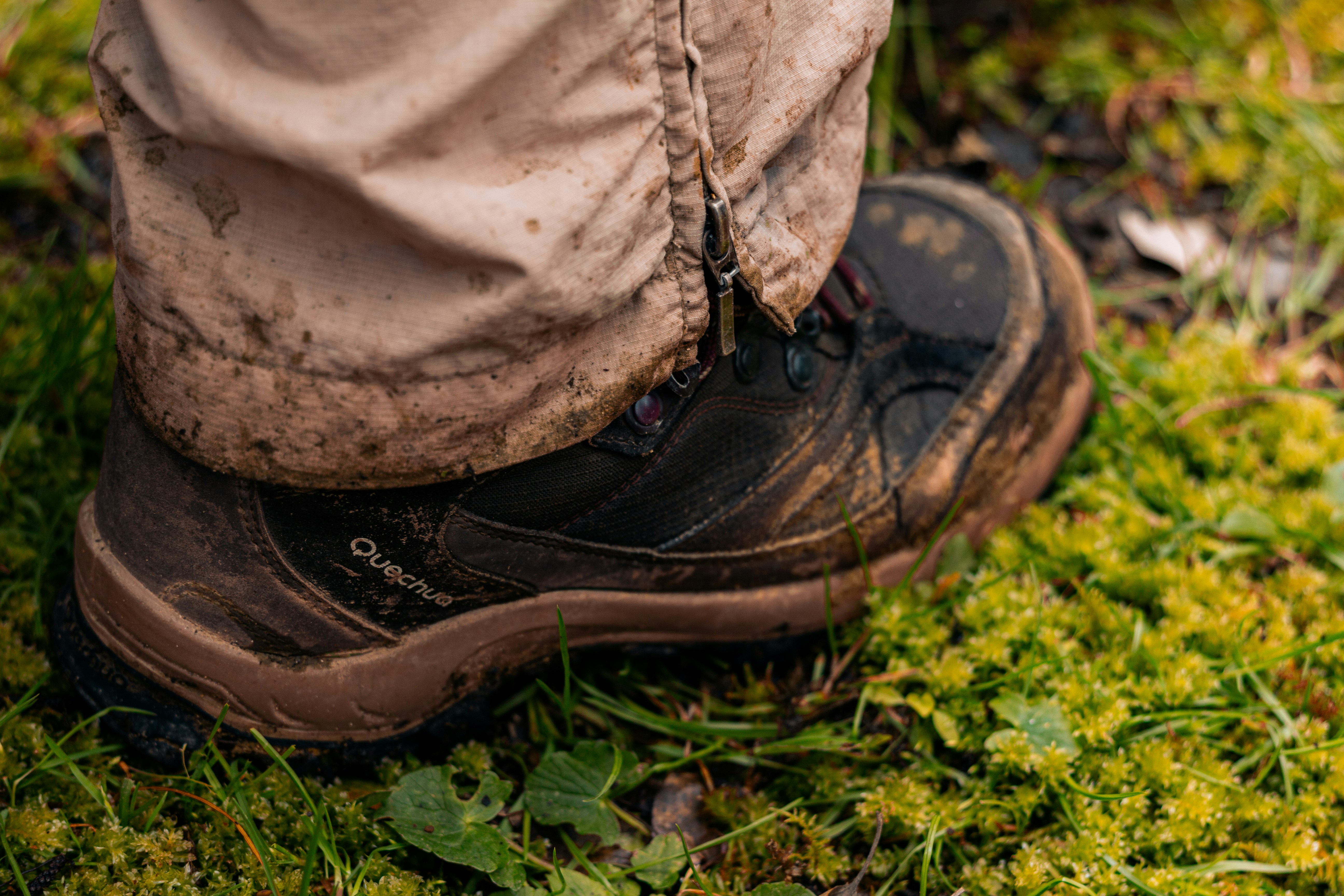 Mud-Streaked Hiking Boot Anchors a Wet-Season Trek