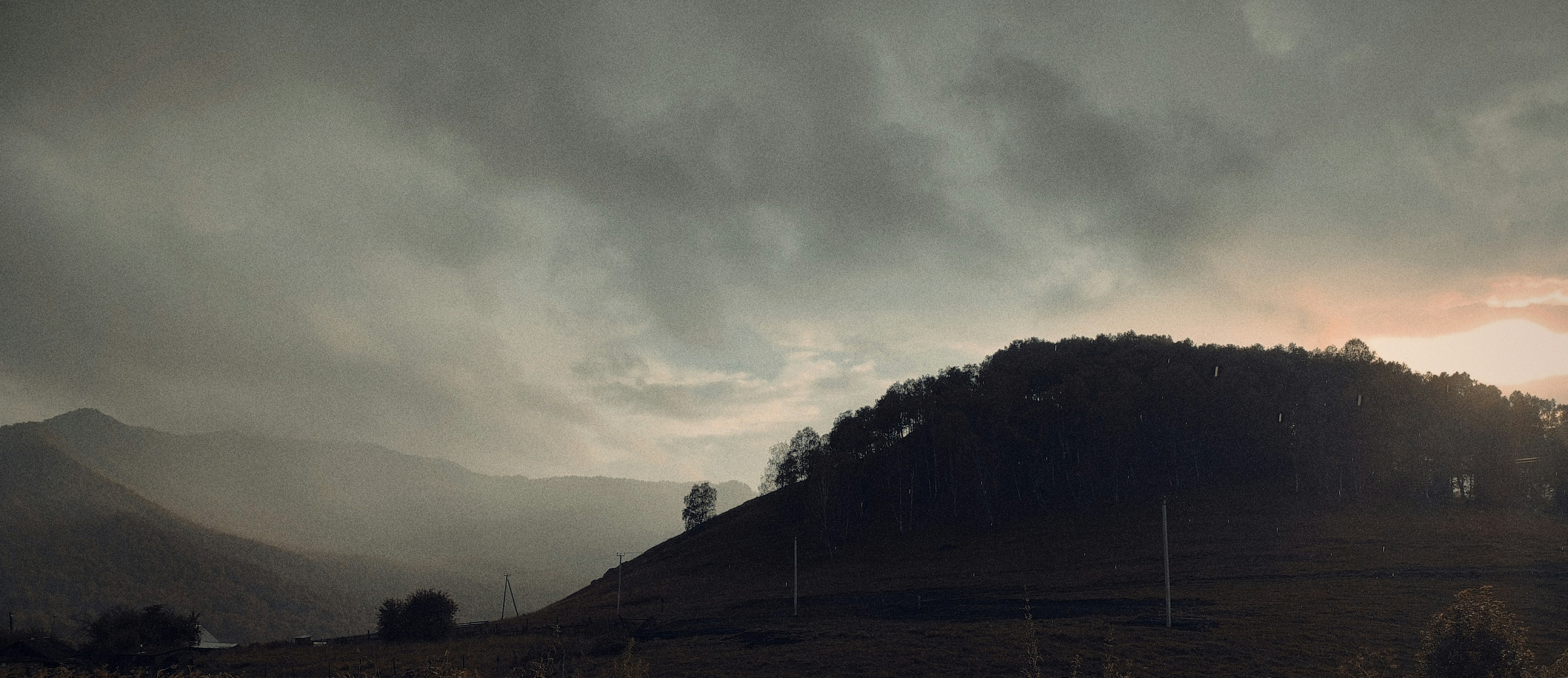 Storm-Soaked Ridge: A Quiet Dusk Over the Valley