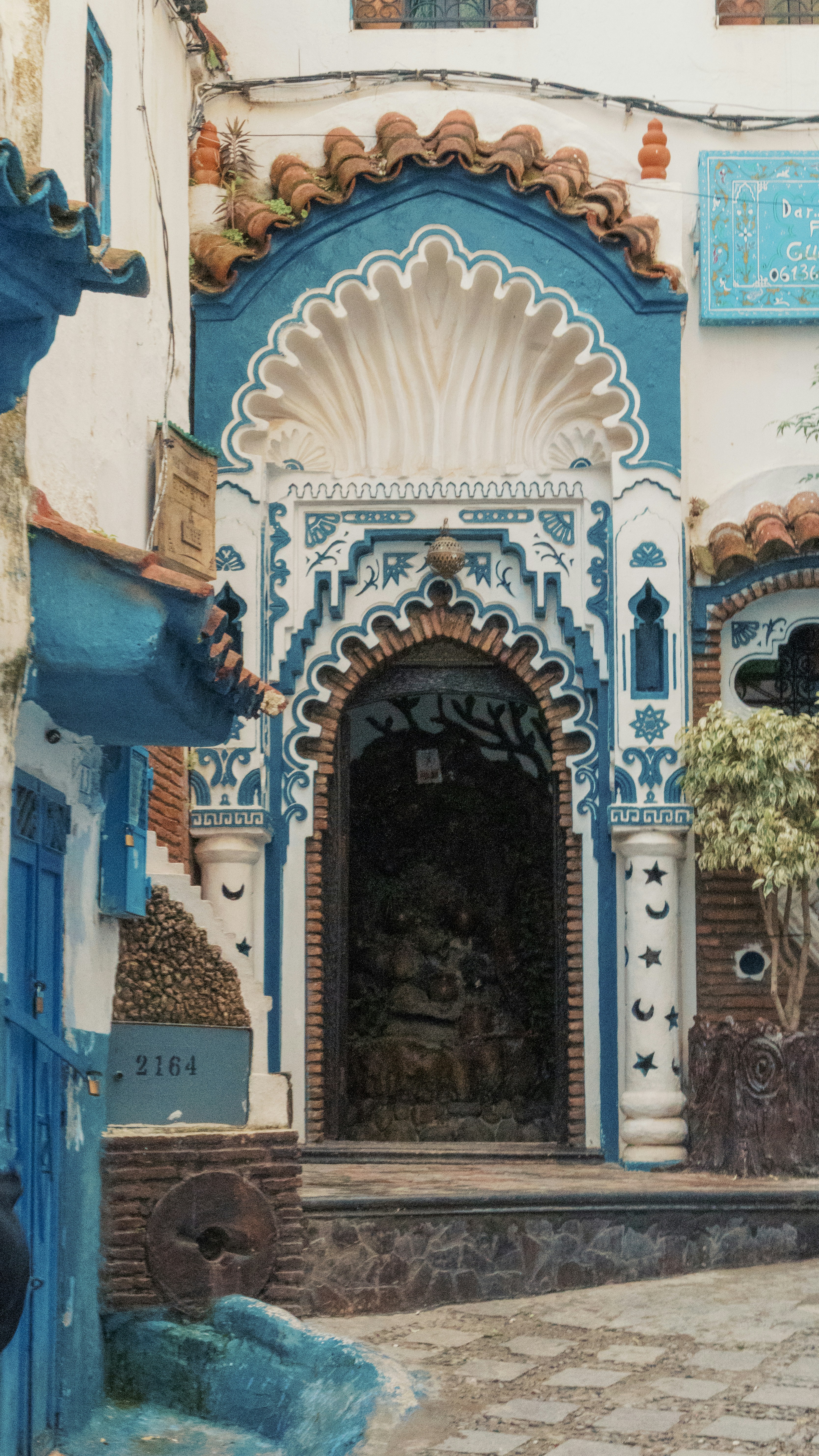 Blue-White Archway of Morocco: A Painted Portal into the Courtyard