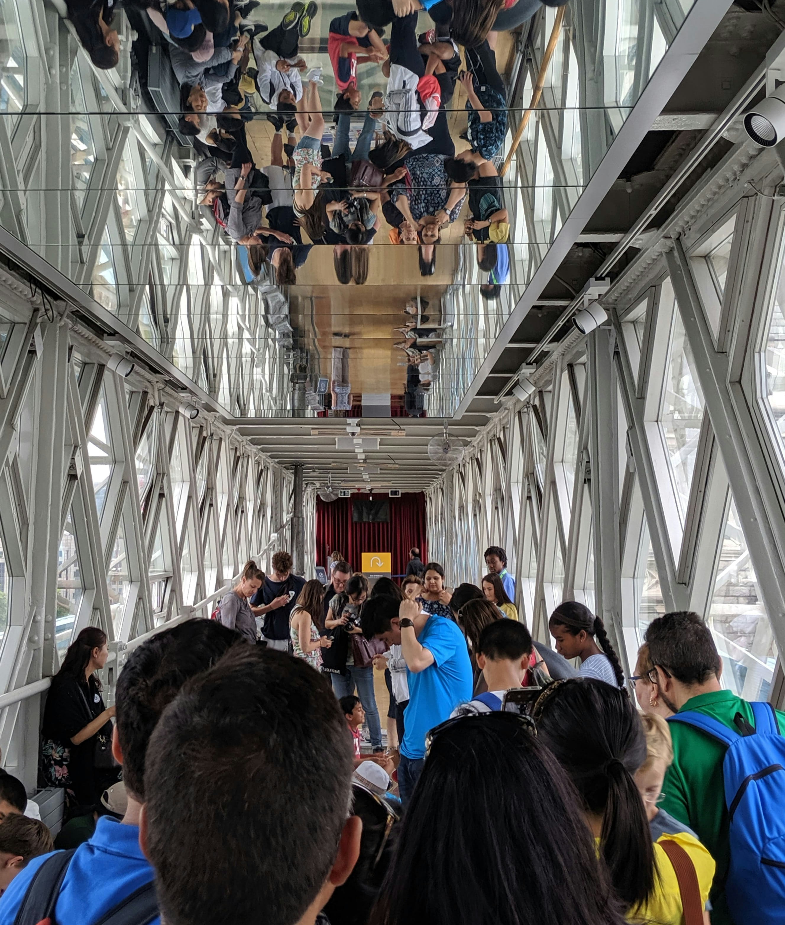 Crowd Corridor: Reflections on a Glass-Bridge