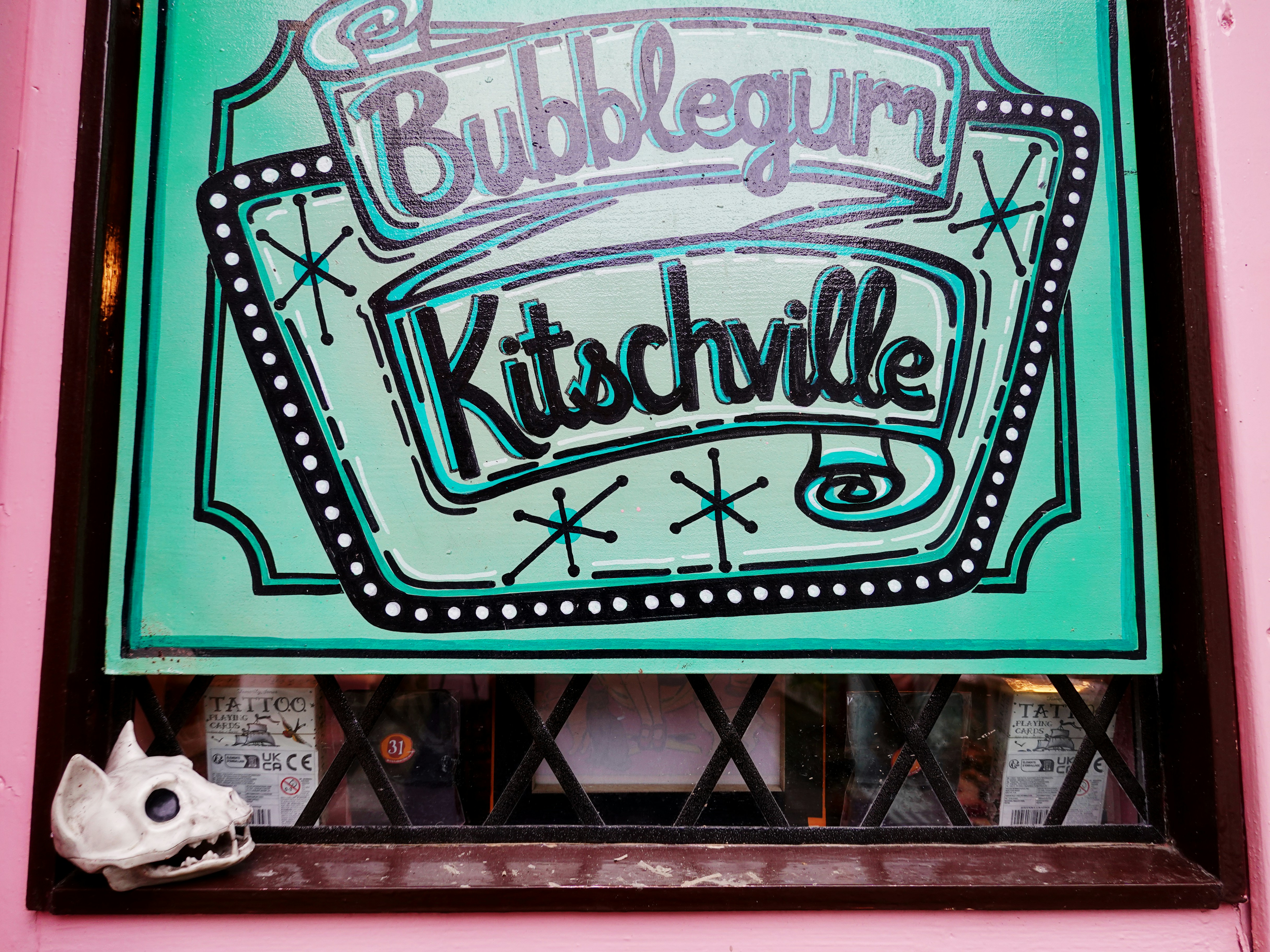 Bubblegum Kitsch: Neon Sign, Windowpane, and a Dinosaur Relic