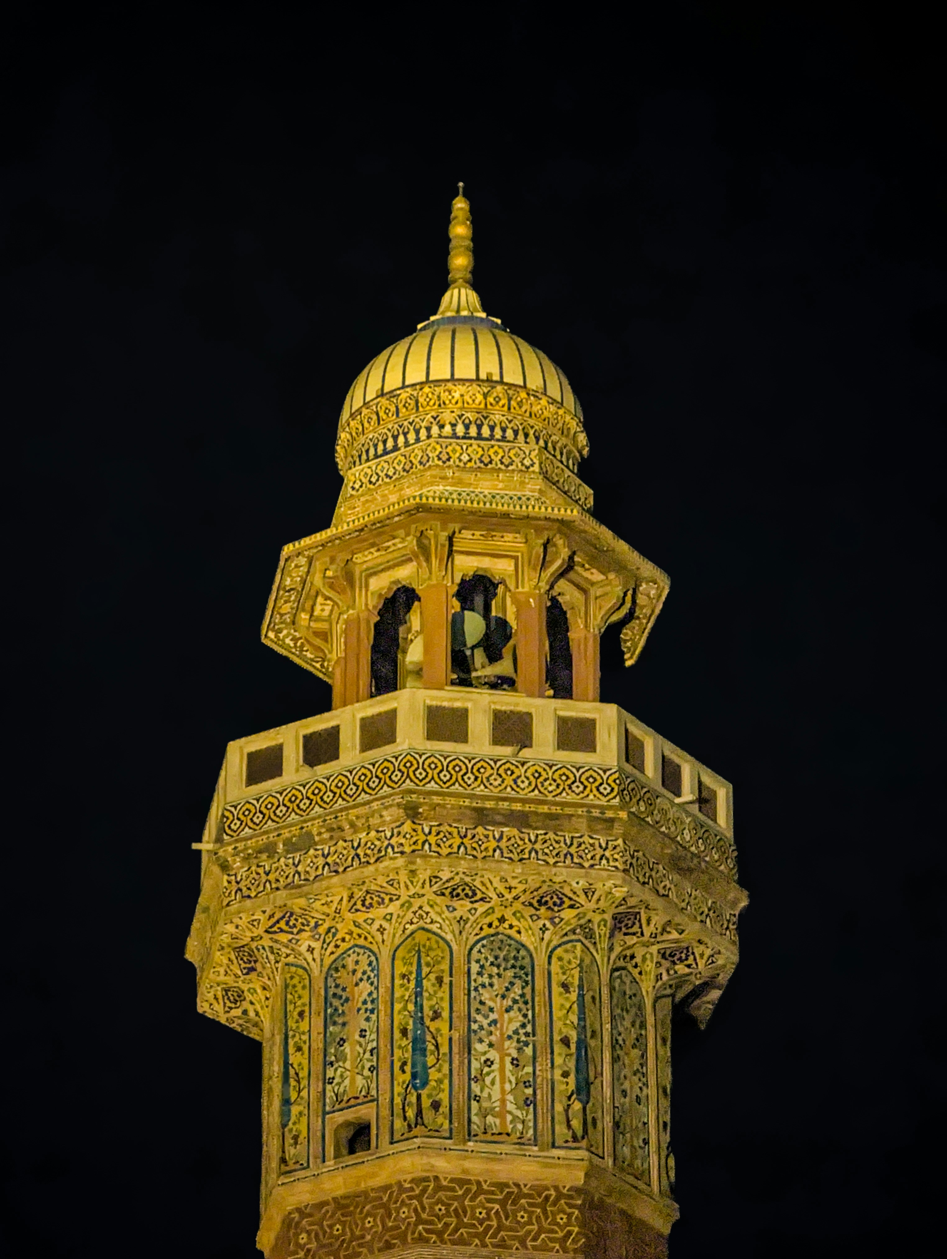 Golden Minaret at Night: Ornate Lantern of Light