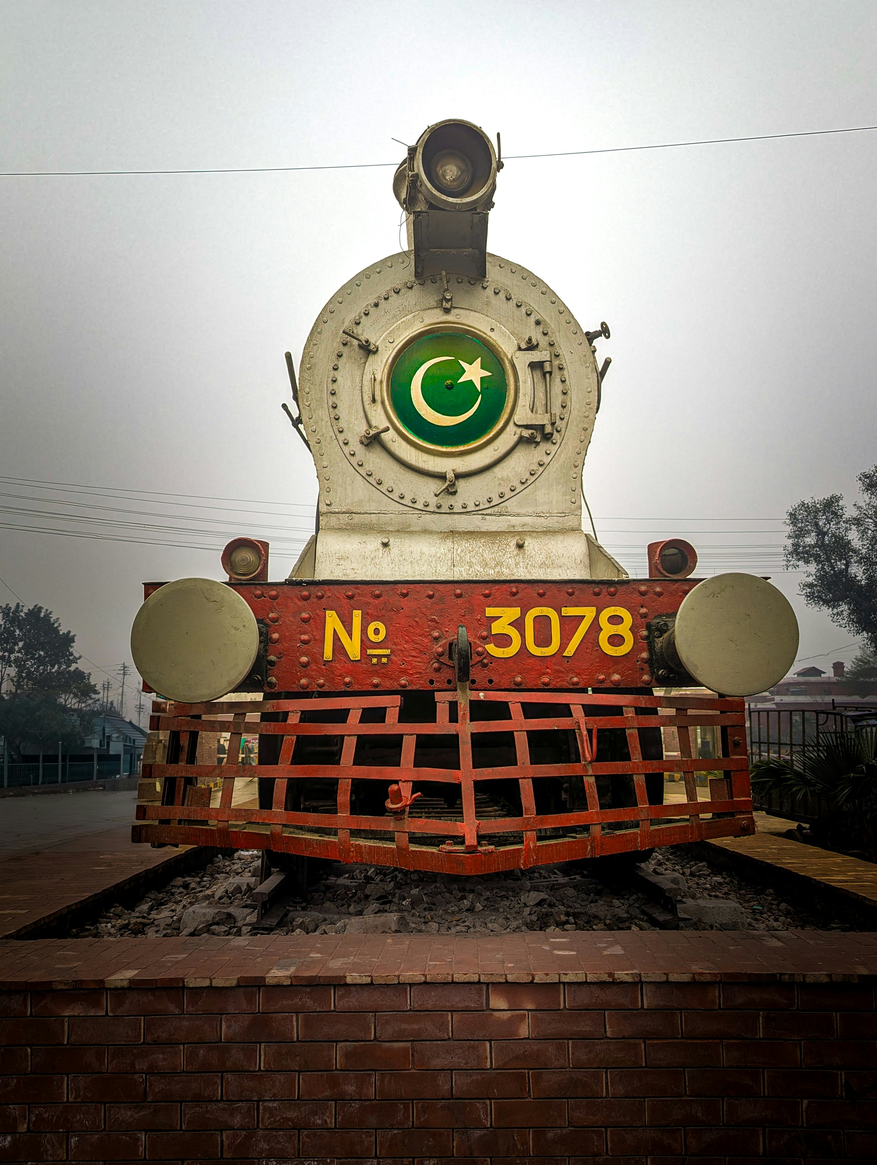 Front-and-Central Locomotive: A Historic Engine Guarded by Steel and Steam