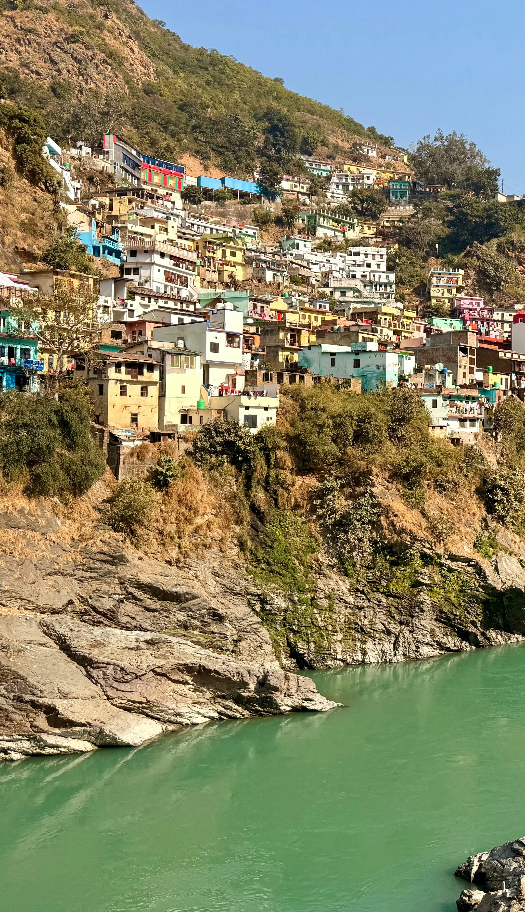  hillside hillside village stacked with colorful houses above a turquoise river