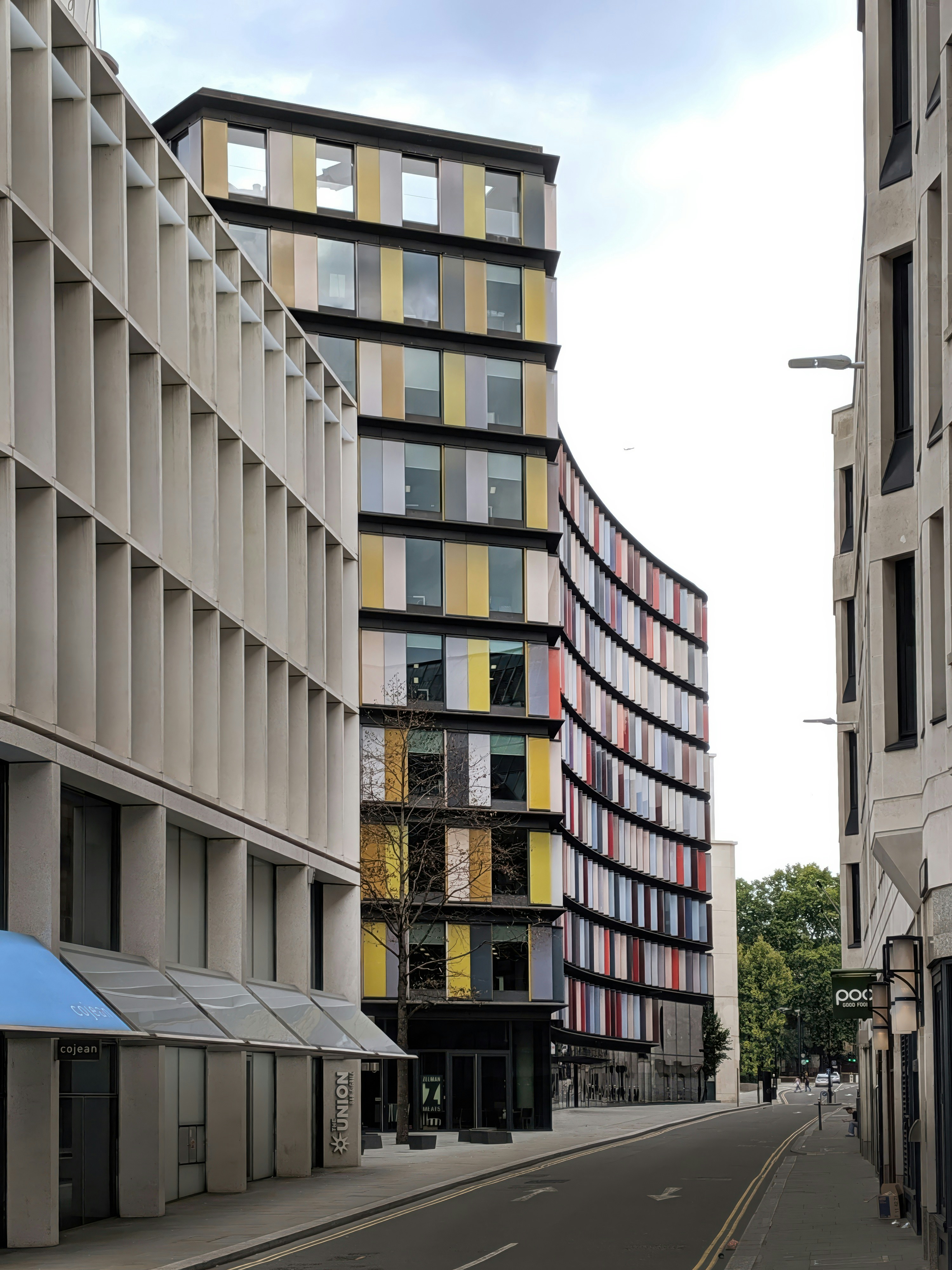 City Facade, Colorful Wave: A Street-Level Portrait of Modern Architecture