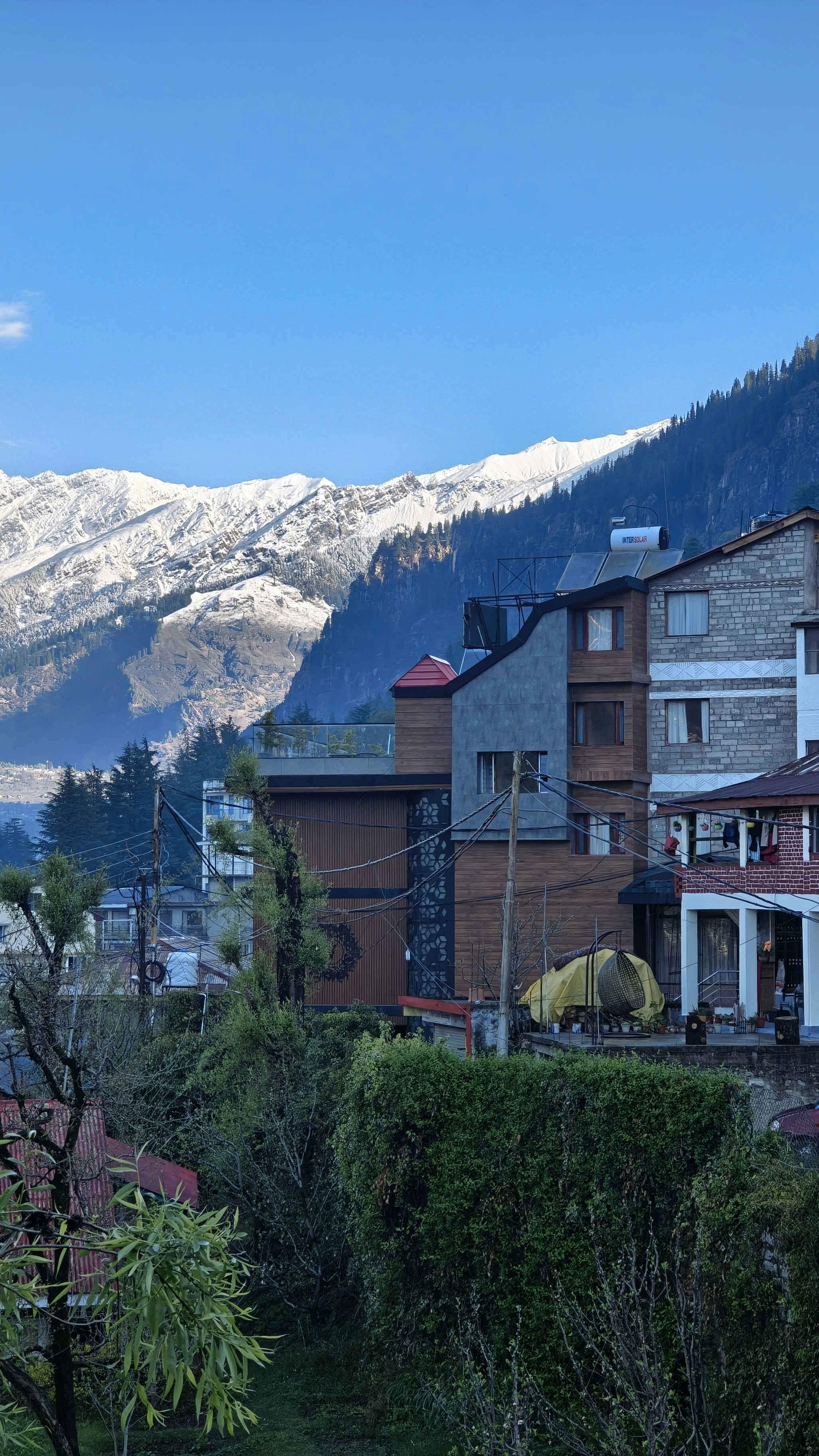 Snow-topped Alps overlook a hillside village