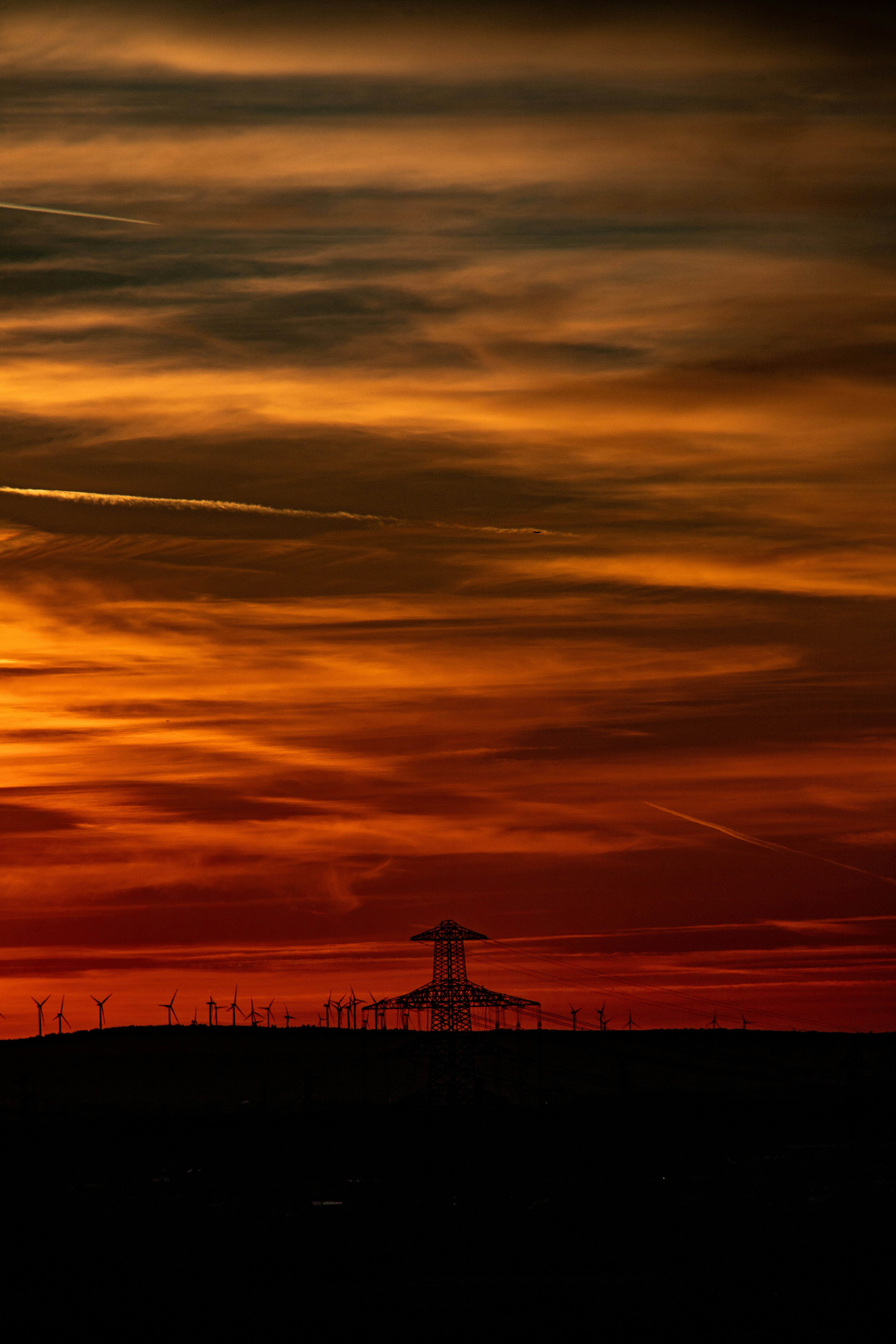 Silhouette Crossing: A Solar Horizon with Power Lines