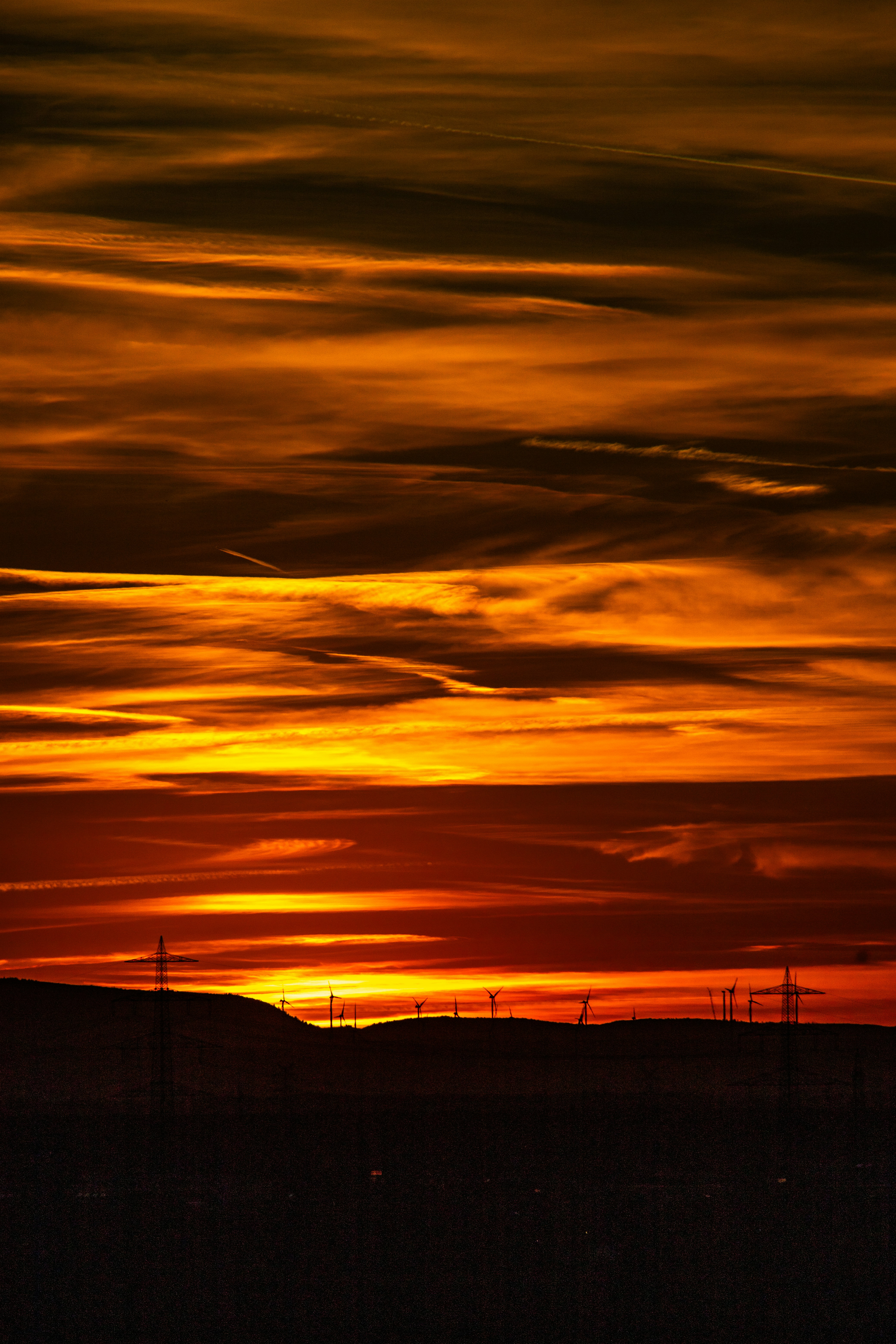 Ember Horizon over the Wind Farm