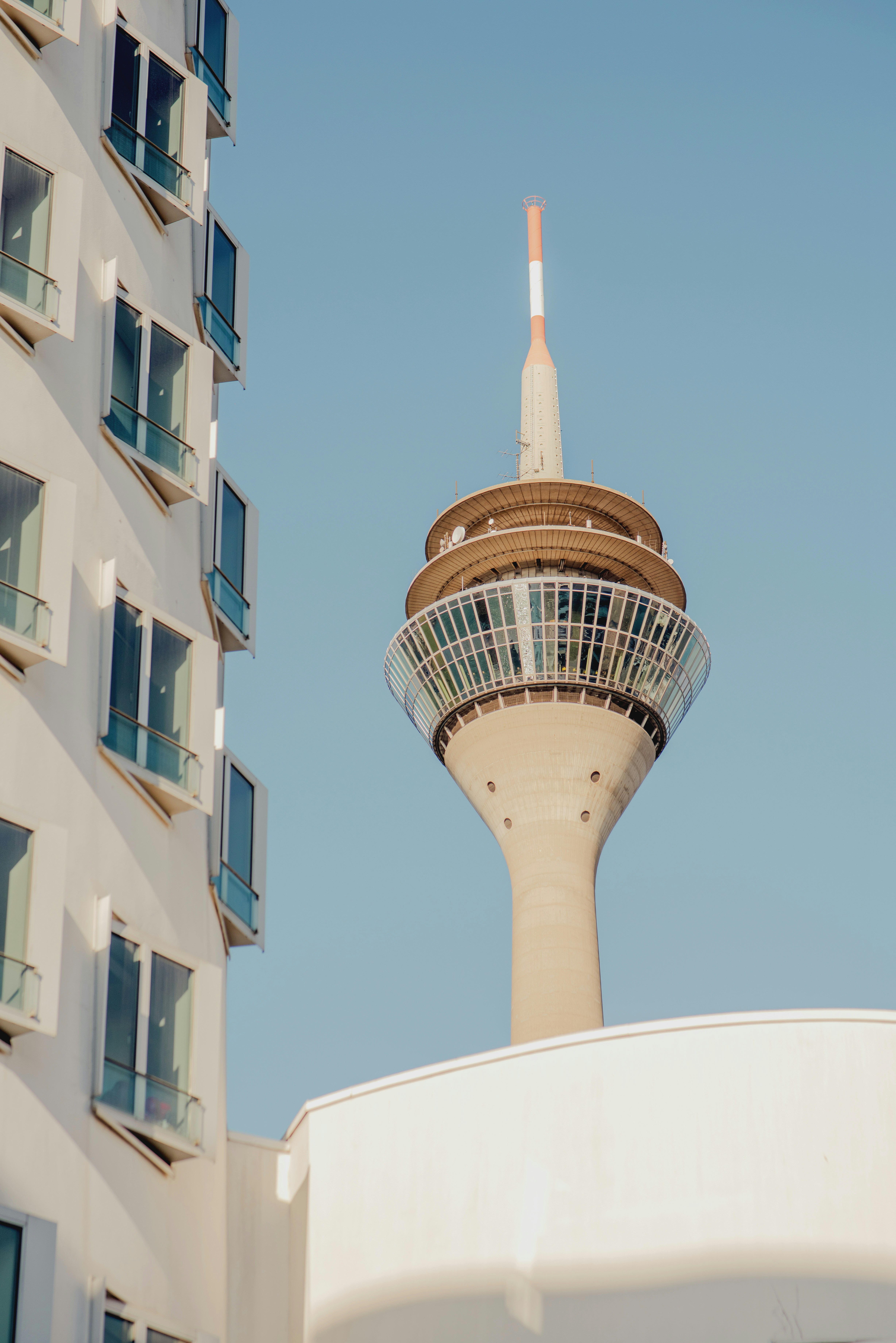 City Tower Silhouette: A Spire Rises Between Modern Facades