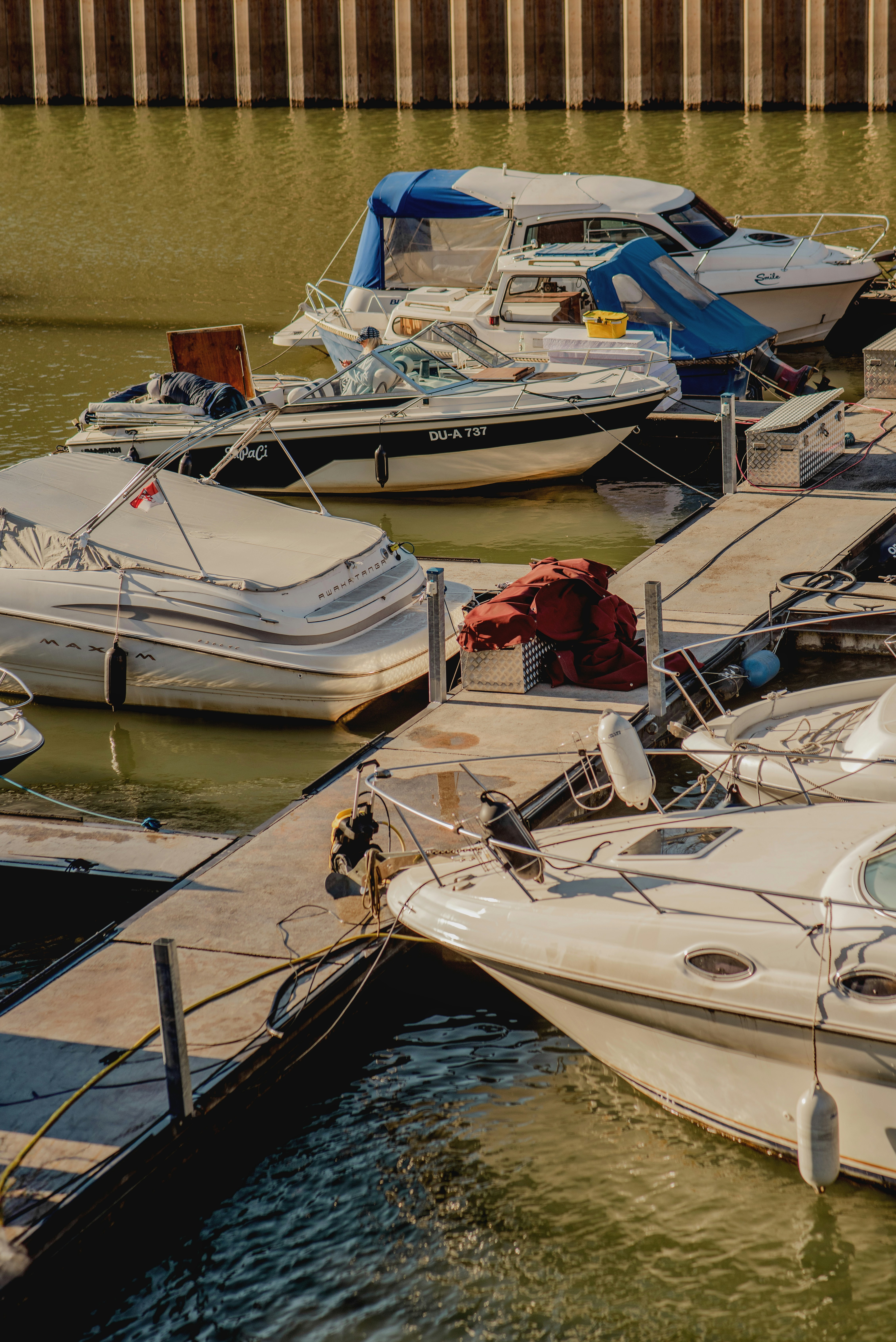 Dockside Array: Boats Resting in Golden Hour Colors