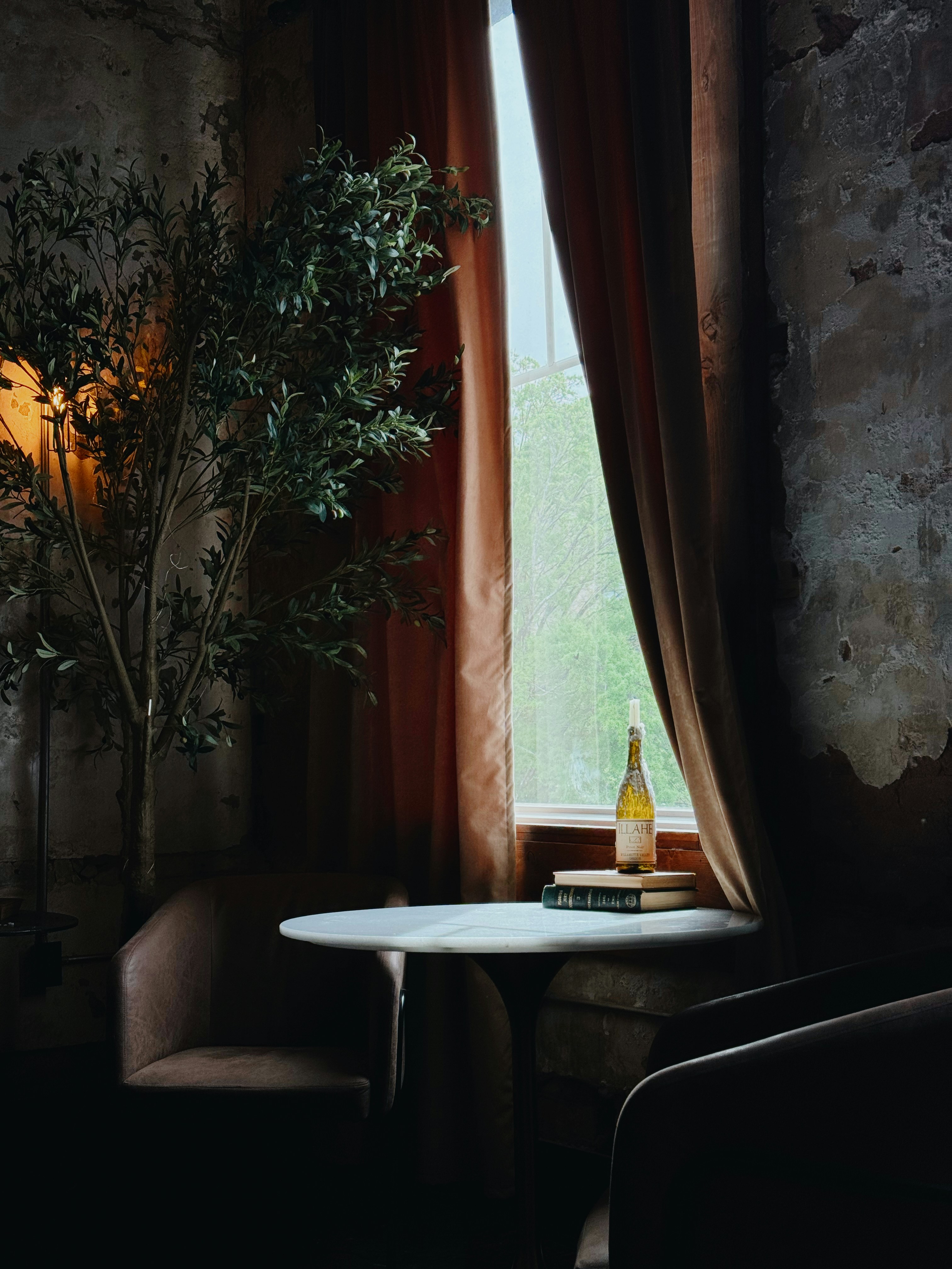 Bottle by the Window: Quiet Moment in a Dim Corner