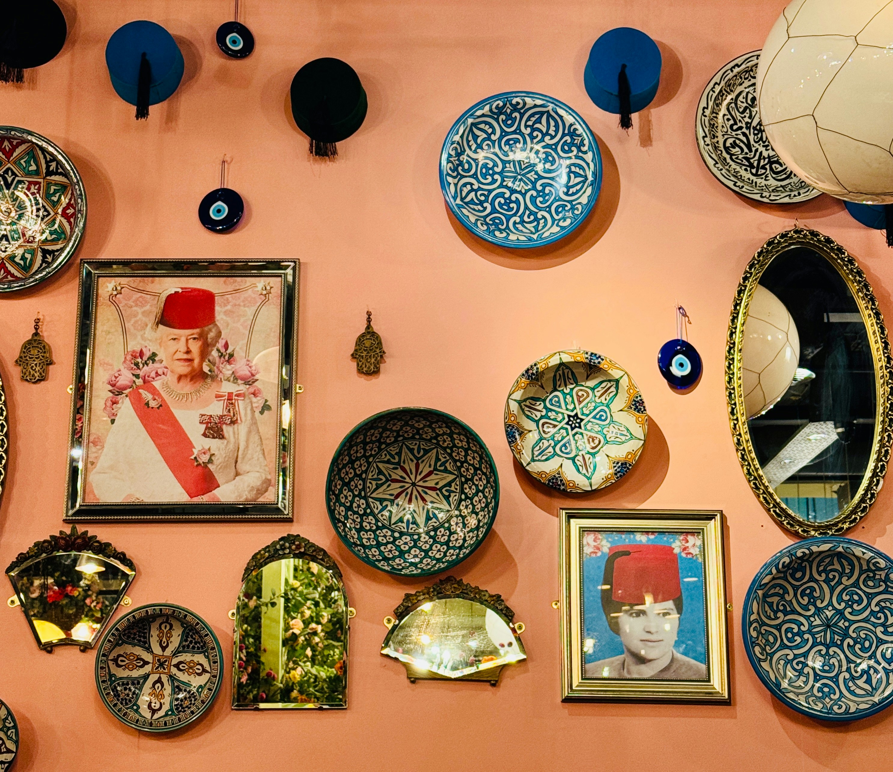 Gallery of Echoes: Colorful Plates and Portraits on a Coral Wall