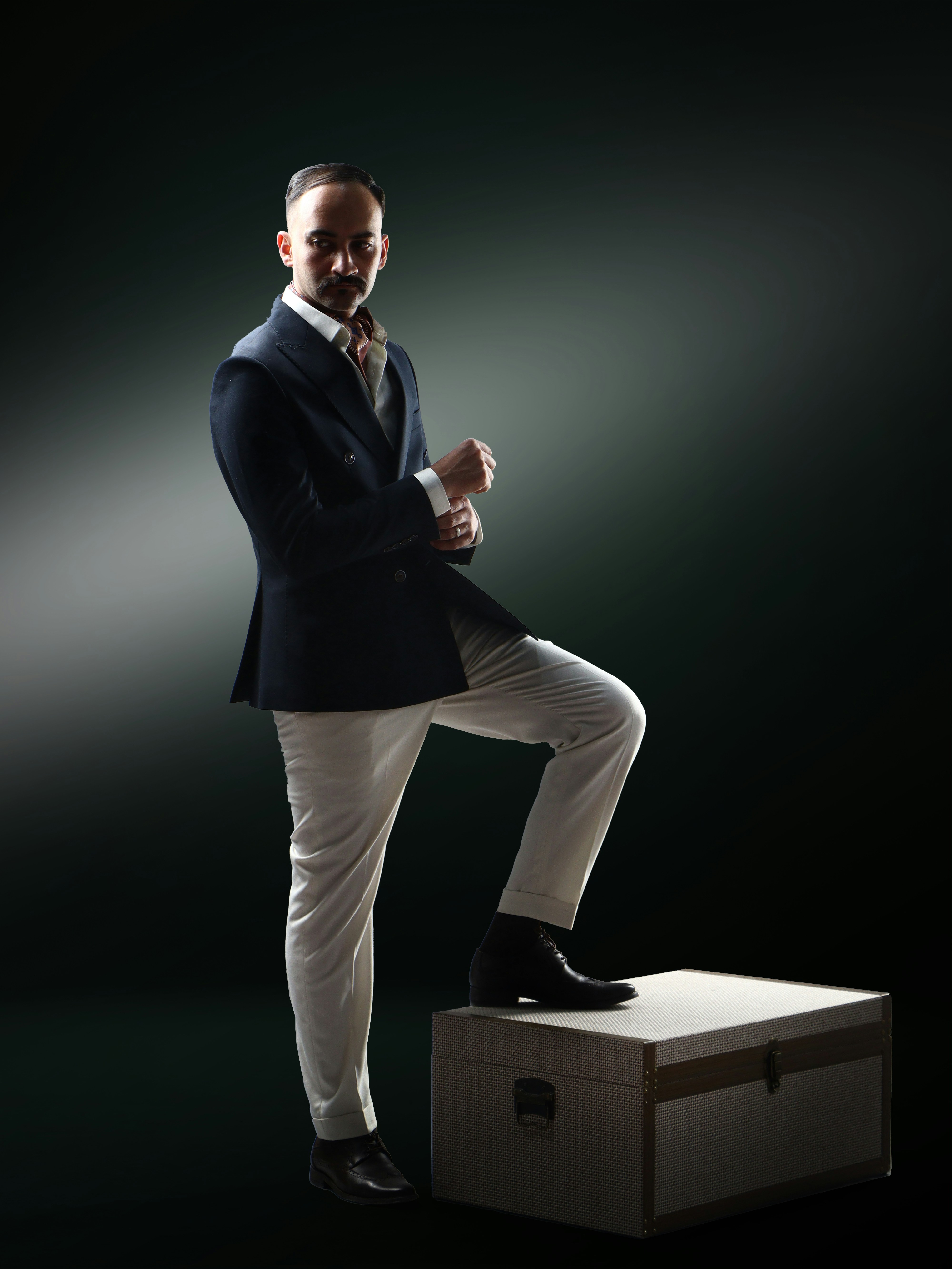 Dressed for the Spotlight: A Poised Gentleman with One Foot Forward