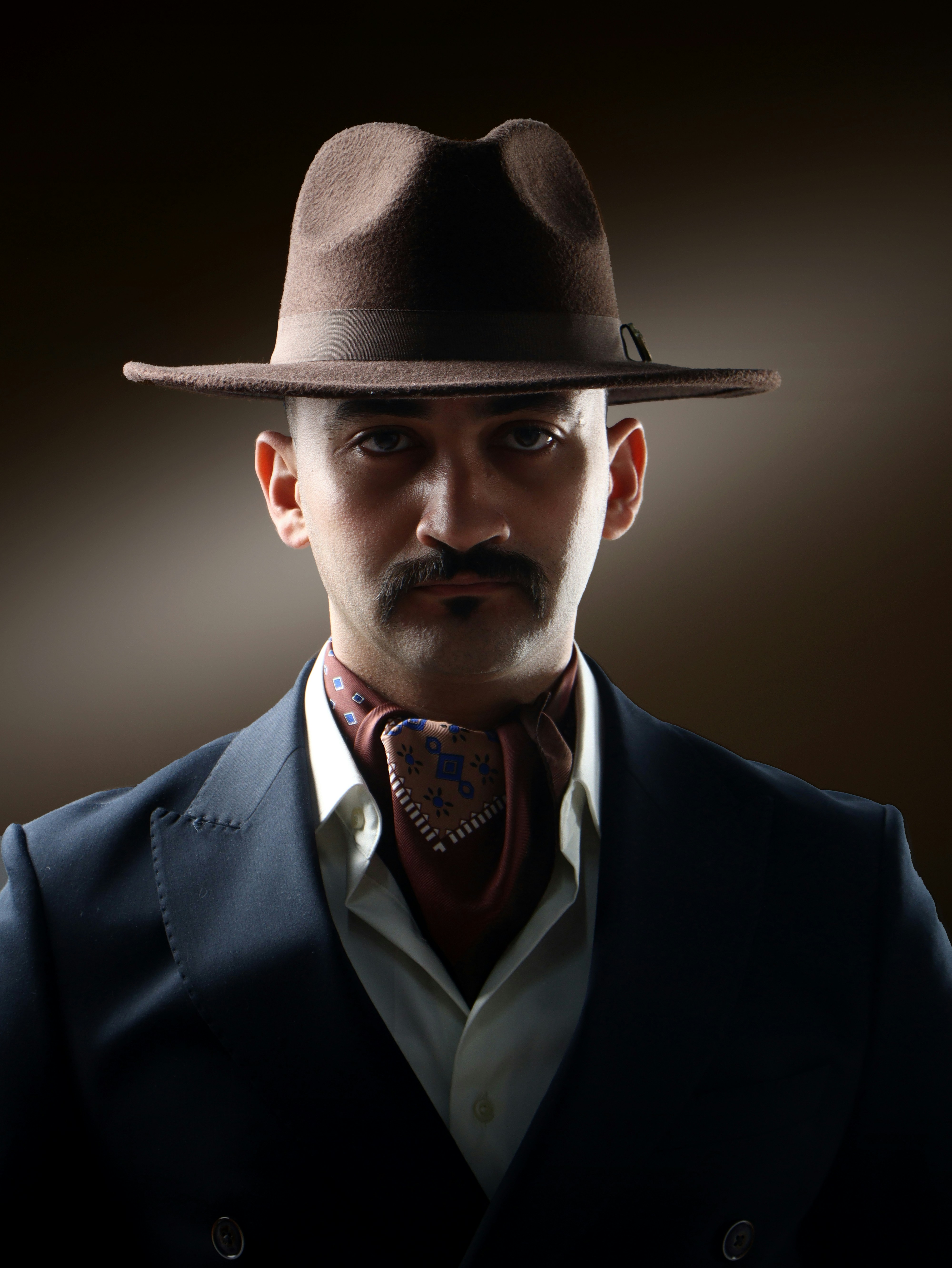 Shadowed Gentleman: A Vintage Hat, A Modern Gaze