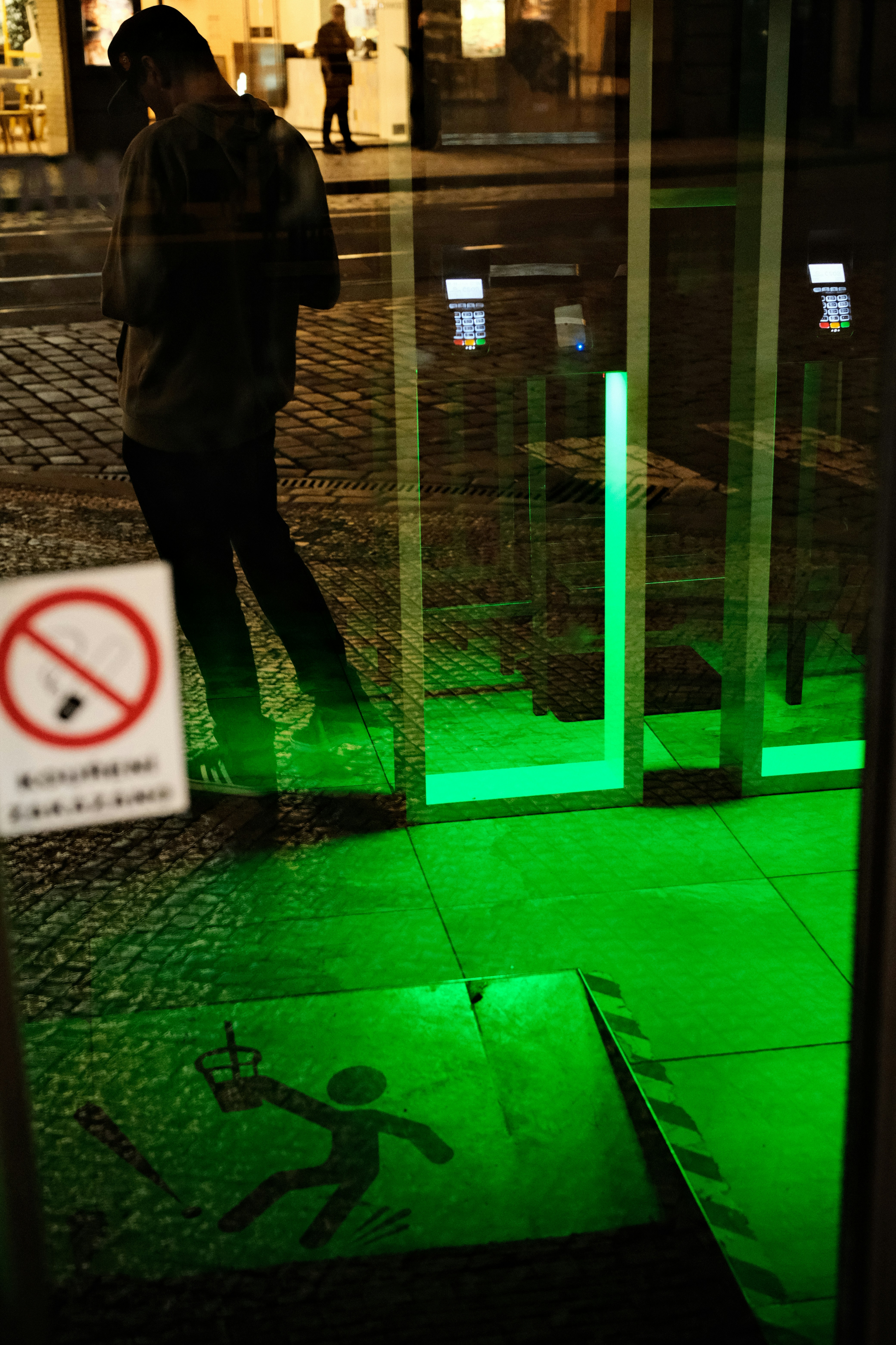 Green-glow Entrance: A Night Walk Through a Quiet Glass Door