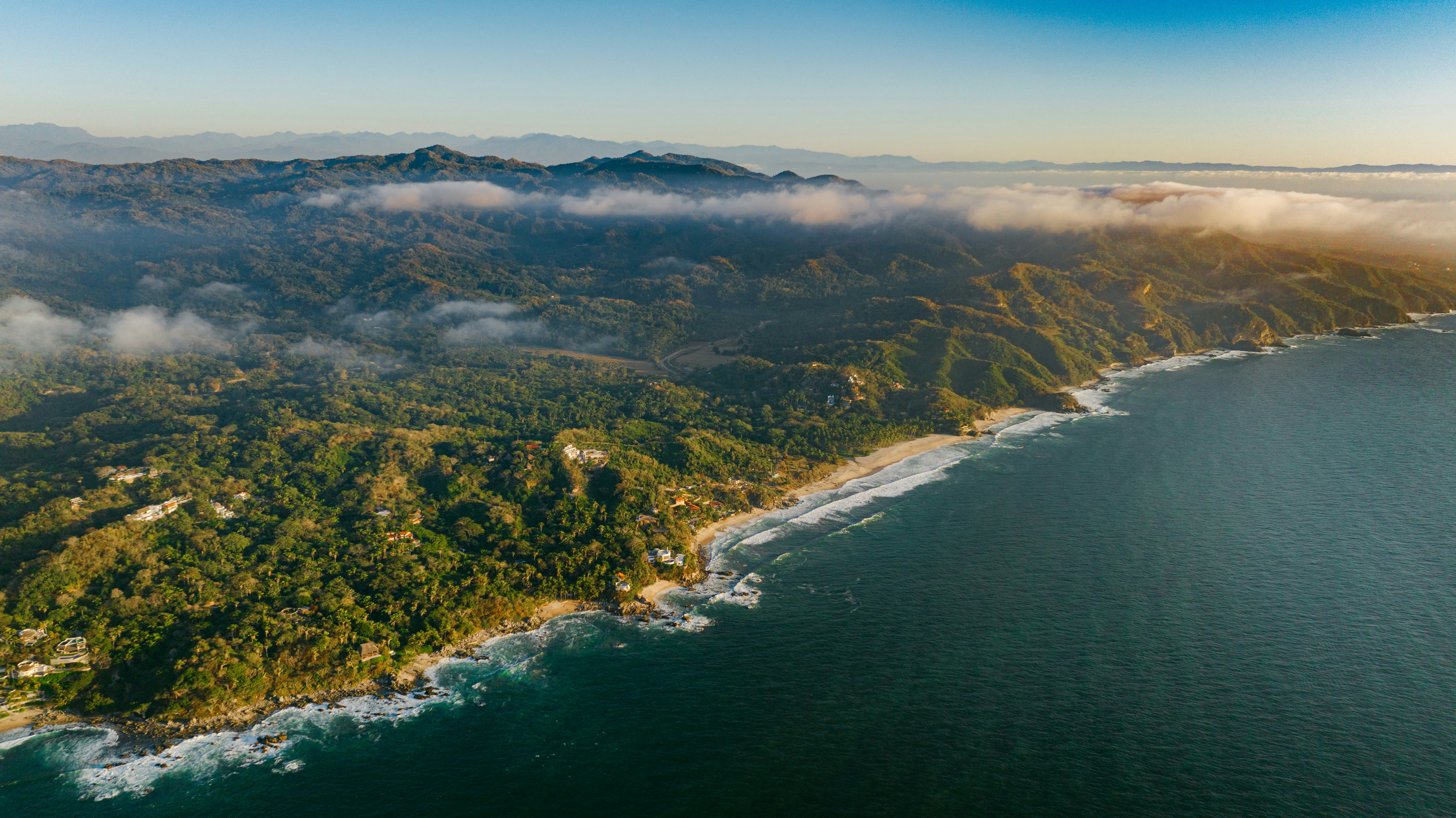 Coastal Ribbon: Aerial Golden Hills Meet Turquoise Sea