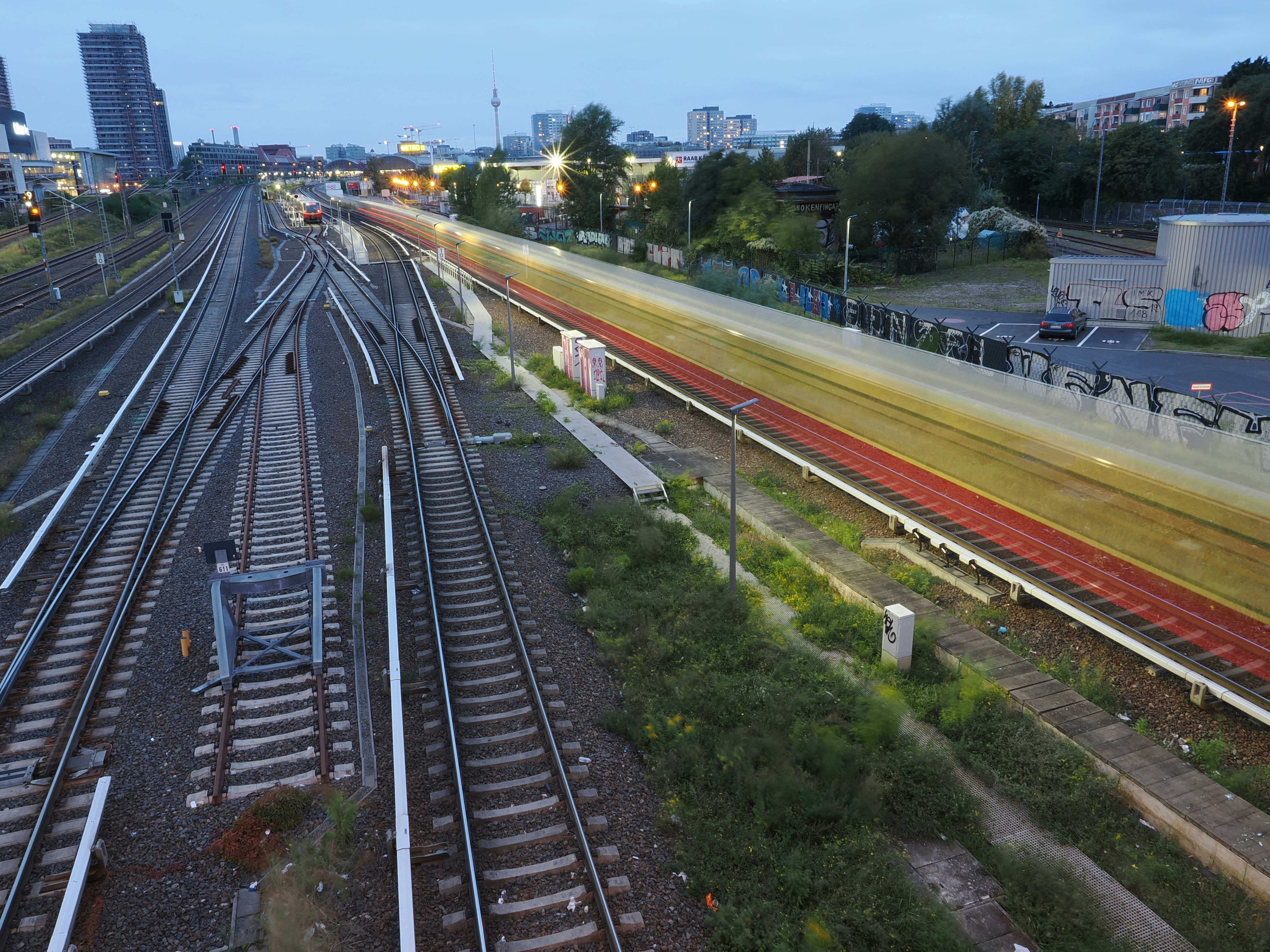 Converging Rails Under City Lights