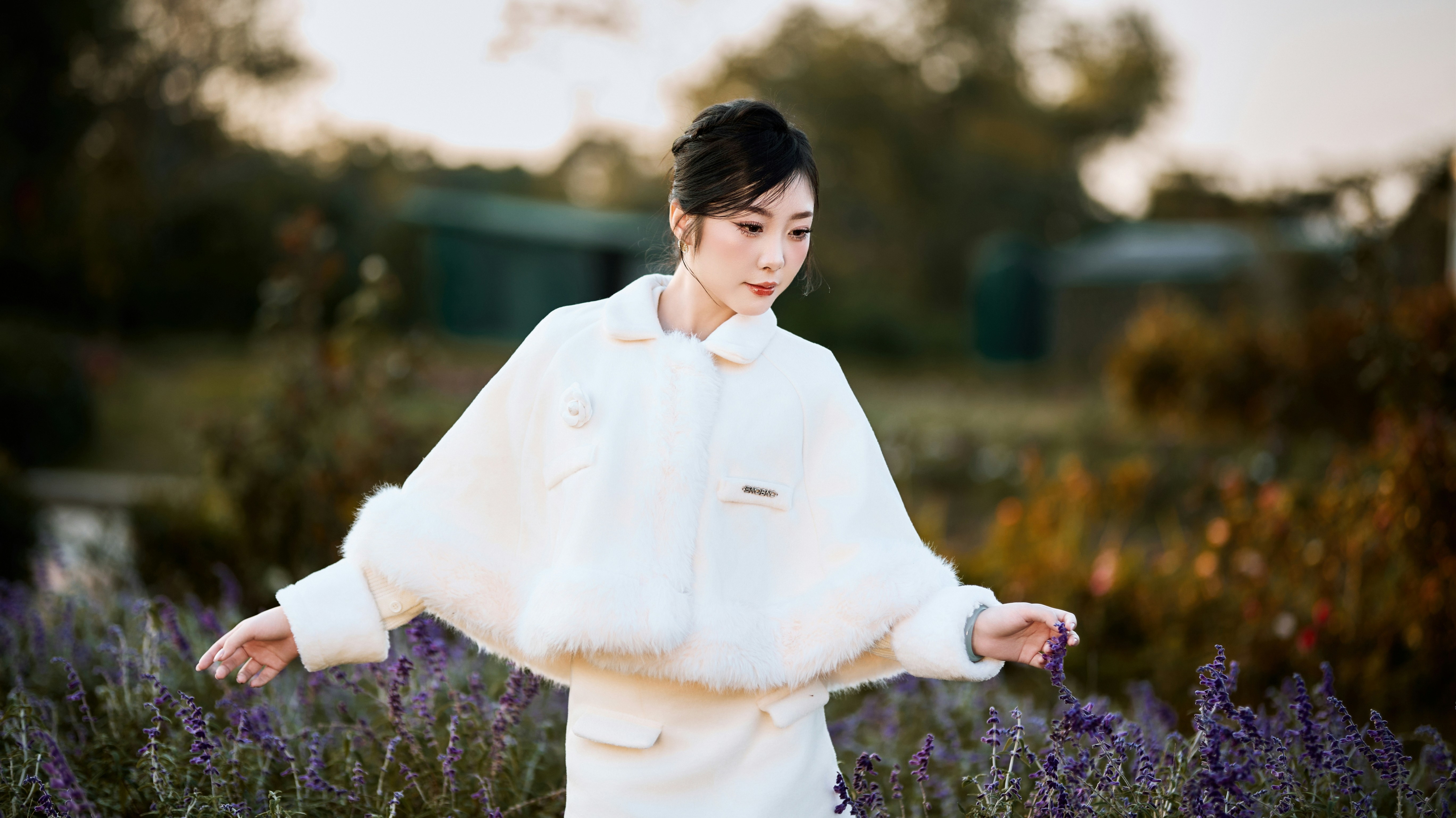 Cozy white coat in a lavender-laden garden scene
