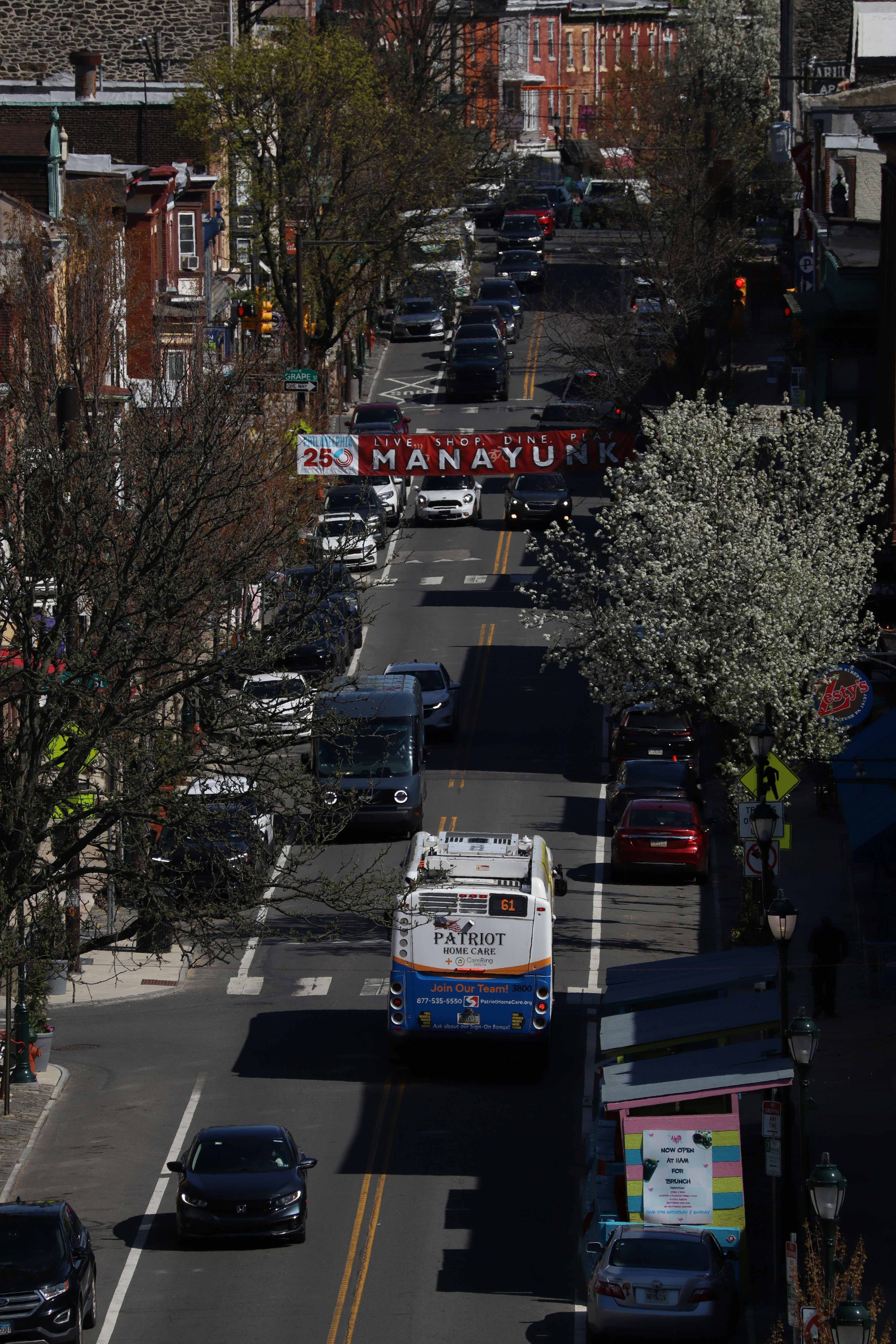 Manayunk Street Banner Over a Busy City Corridor