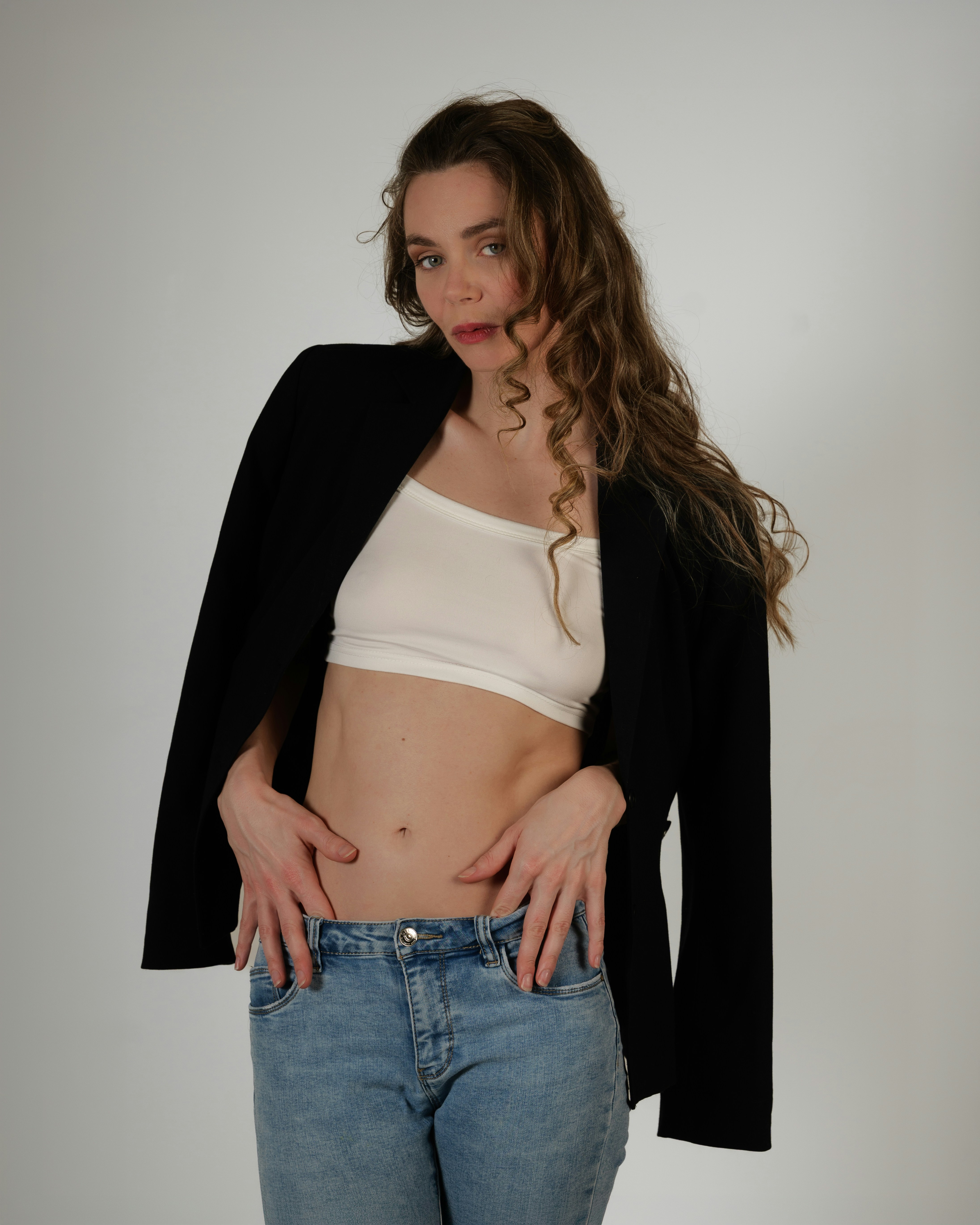 Midnight Confidence: A Casual Pose in Noir and Denim