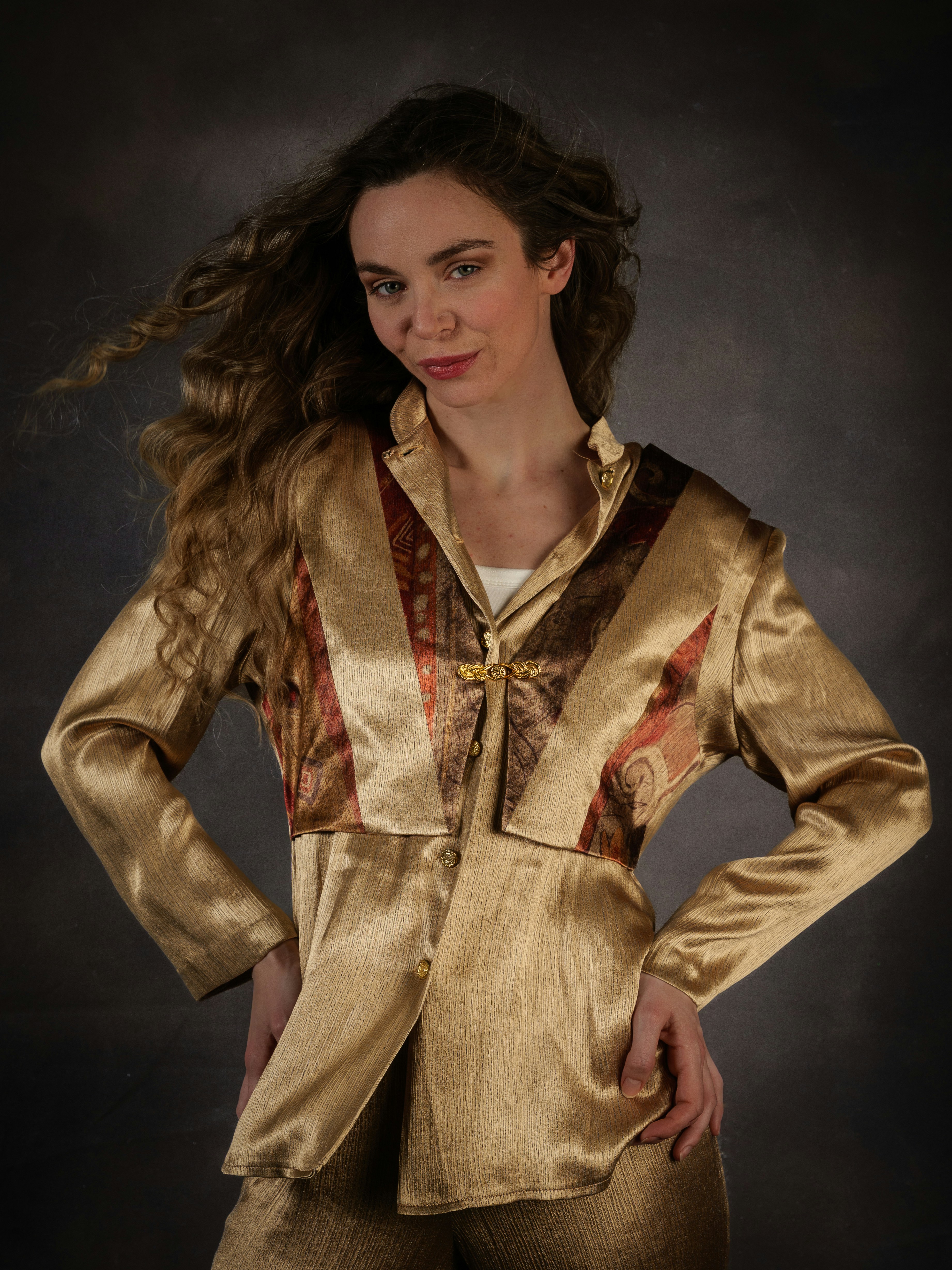Velvet Portrait in Warm Gold: Regal Attire and Flowing Hair