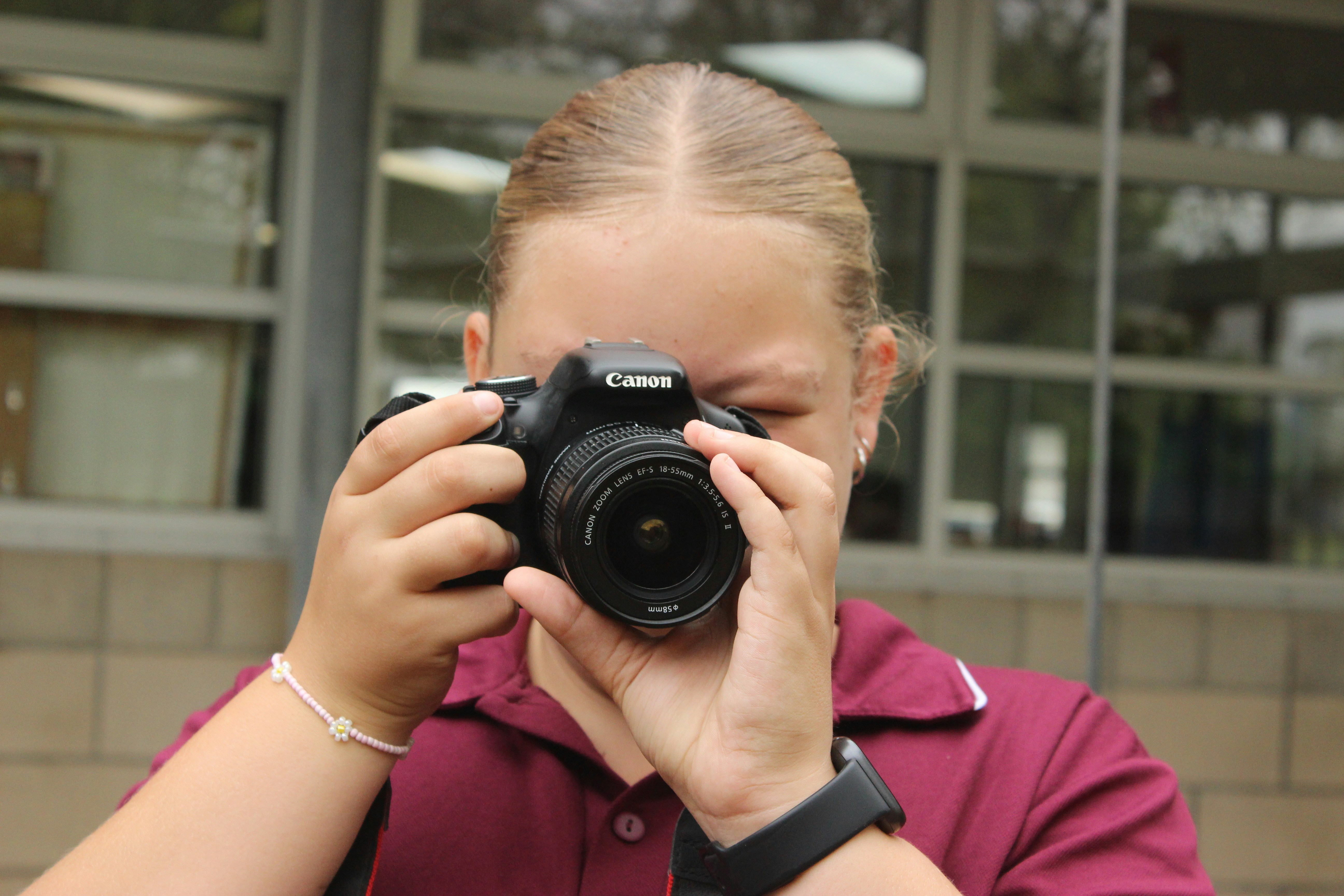 Focused on the Lens: A Portrait Behind the Canon