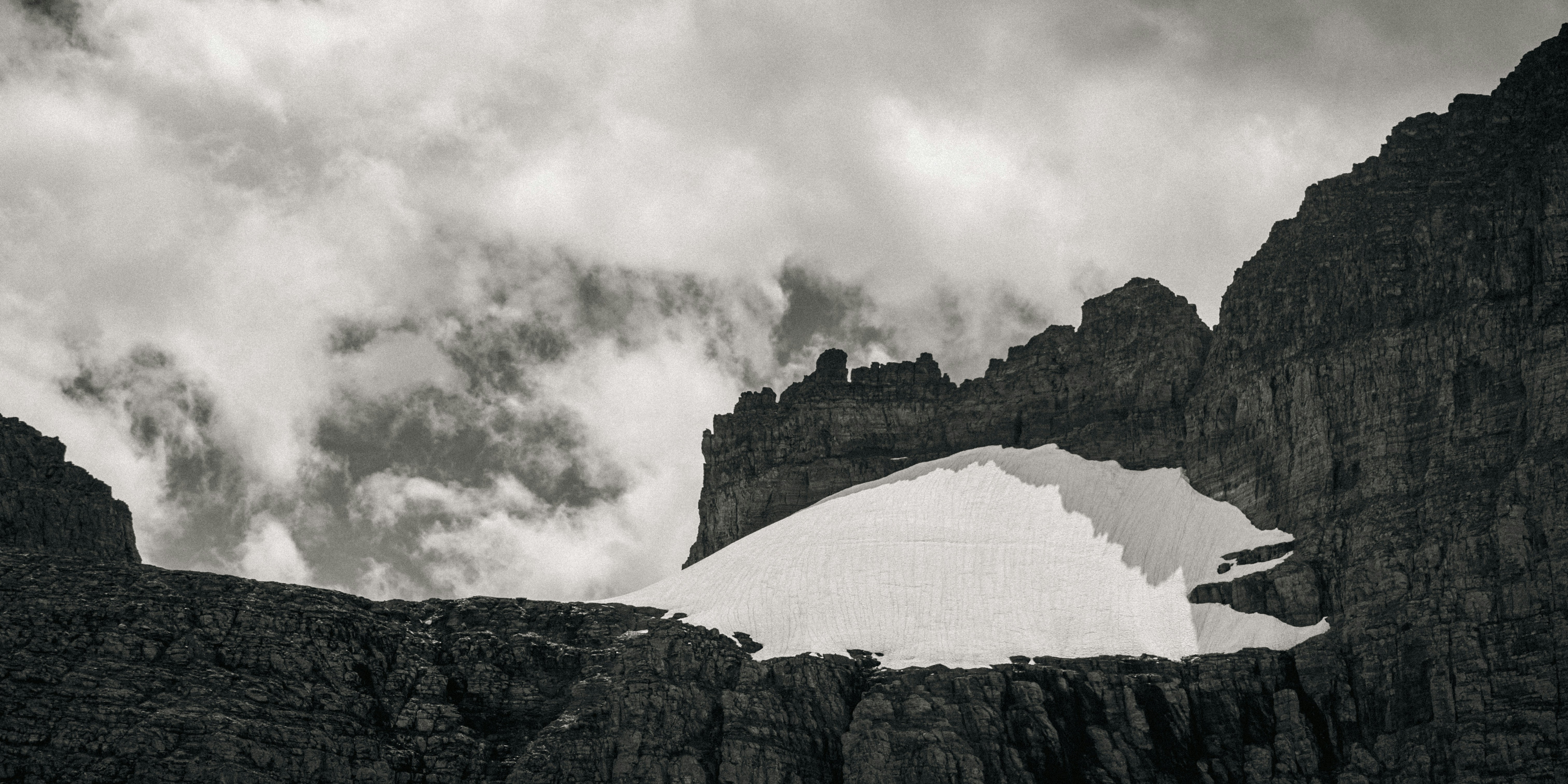 Snowbound Crest: A Black-and-White Passage Through Jagged Peaks