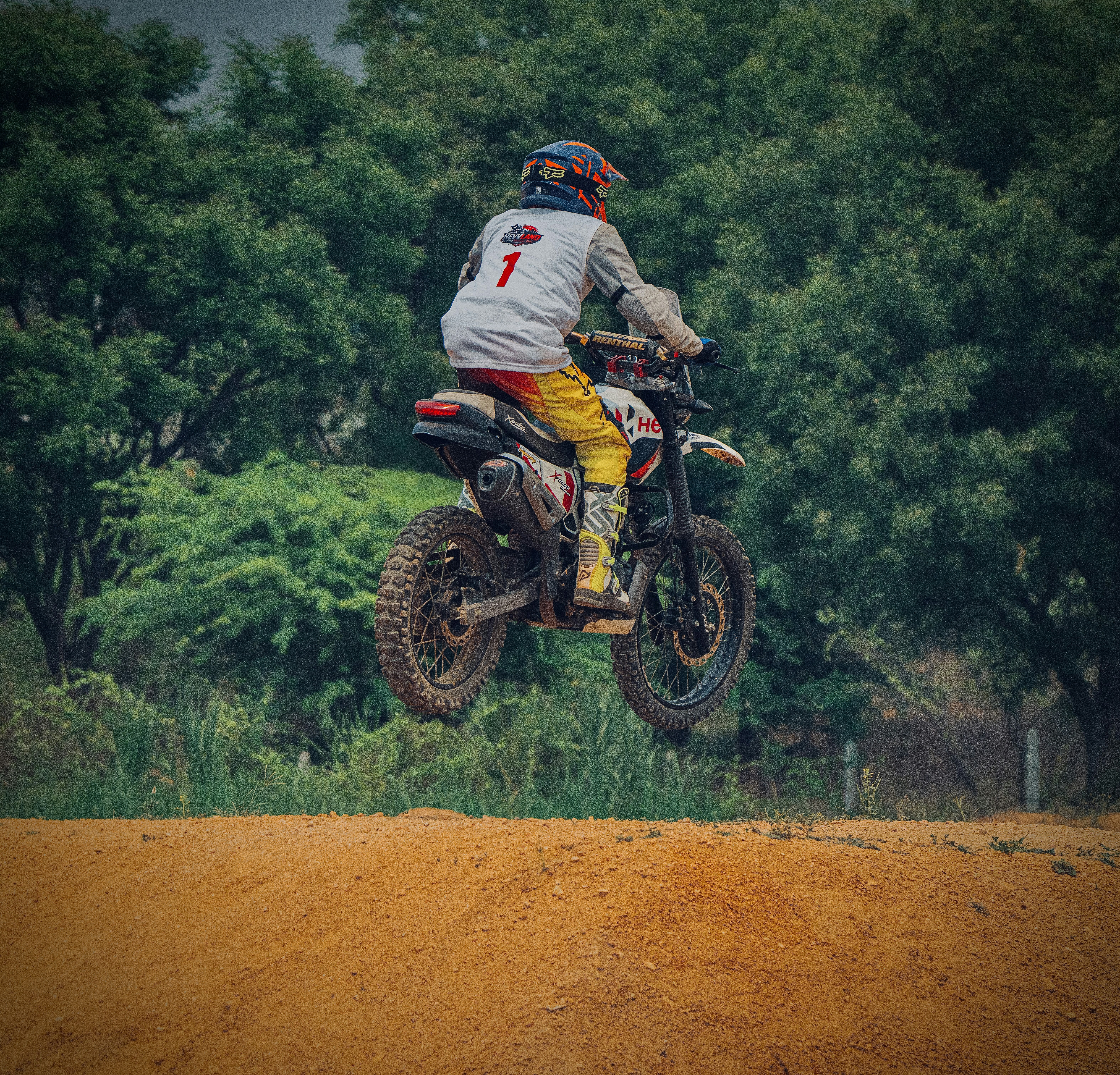 Mid‑Air Sprint: Rider Defies Ground on a Dirt Jump
