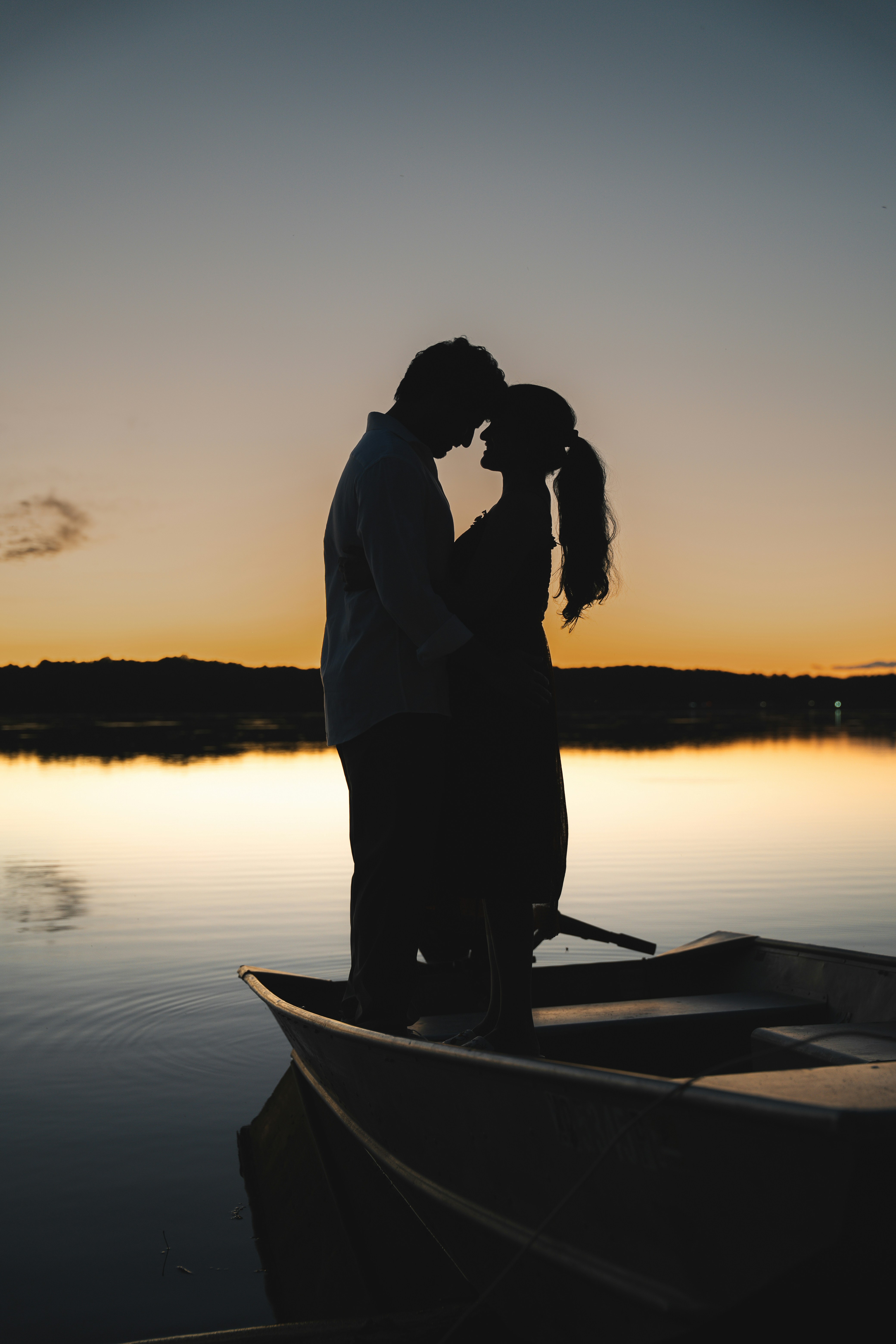 Silhouette Serenade on a Quiet Lake at Sunset