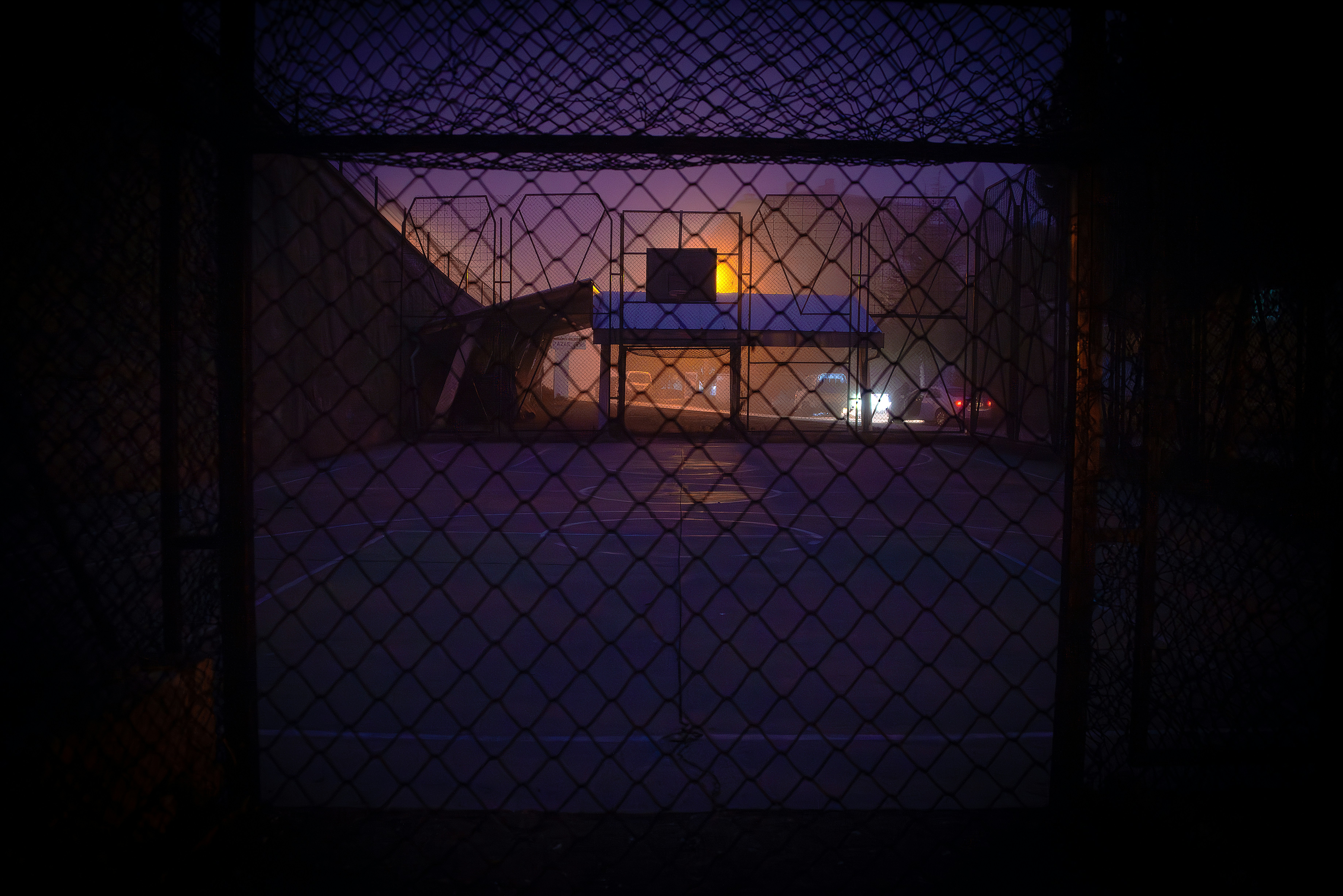 Gate of Night: Neon Glow Beyond the Chain-Link