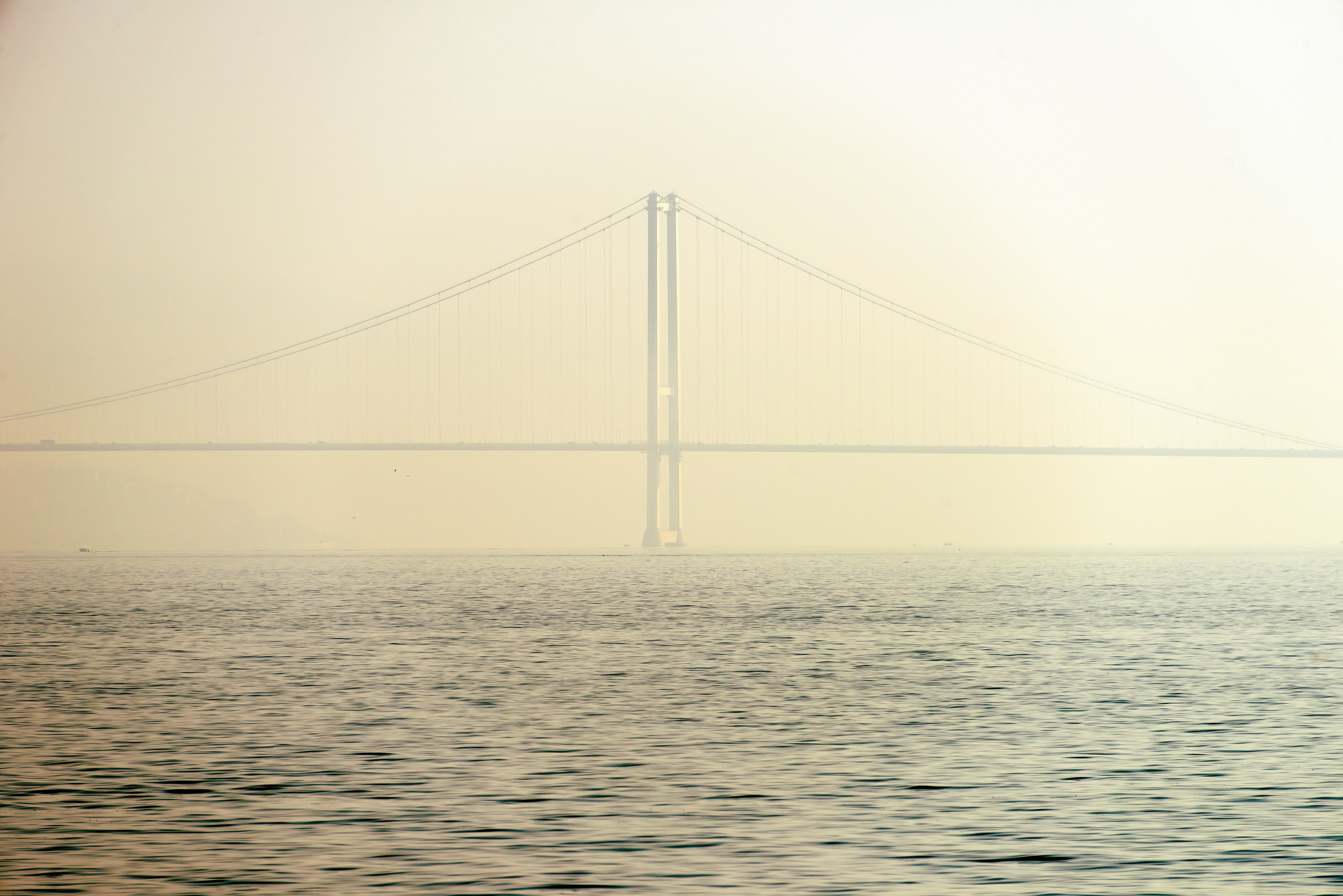 Mist over the Great Span: A Quiet Maritime Sunrise