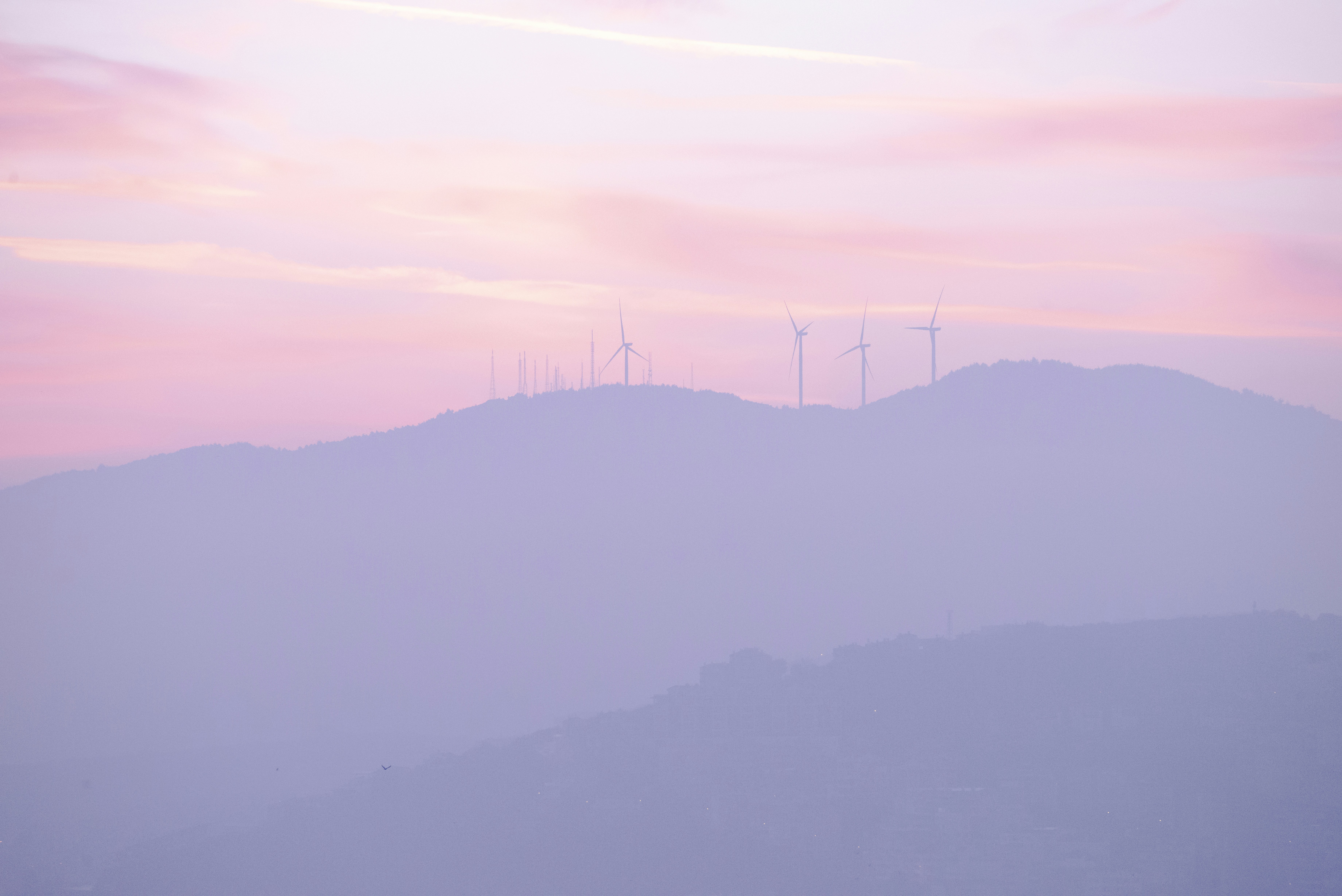 Sunset Quiet: Wind Turbines On a Hazy Ridge