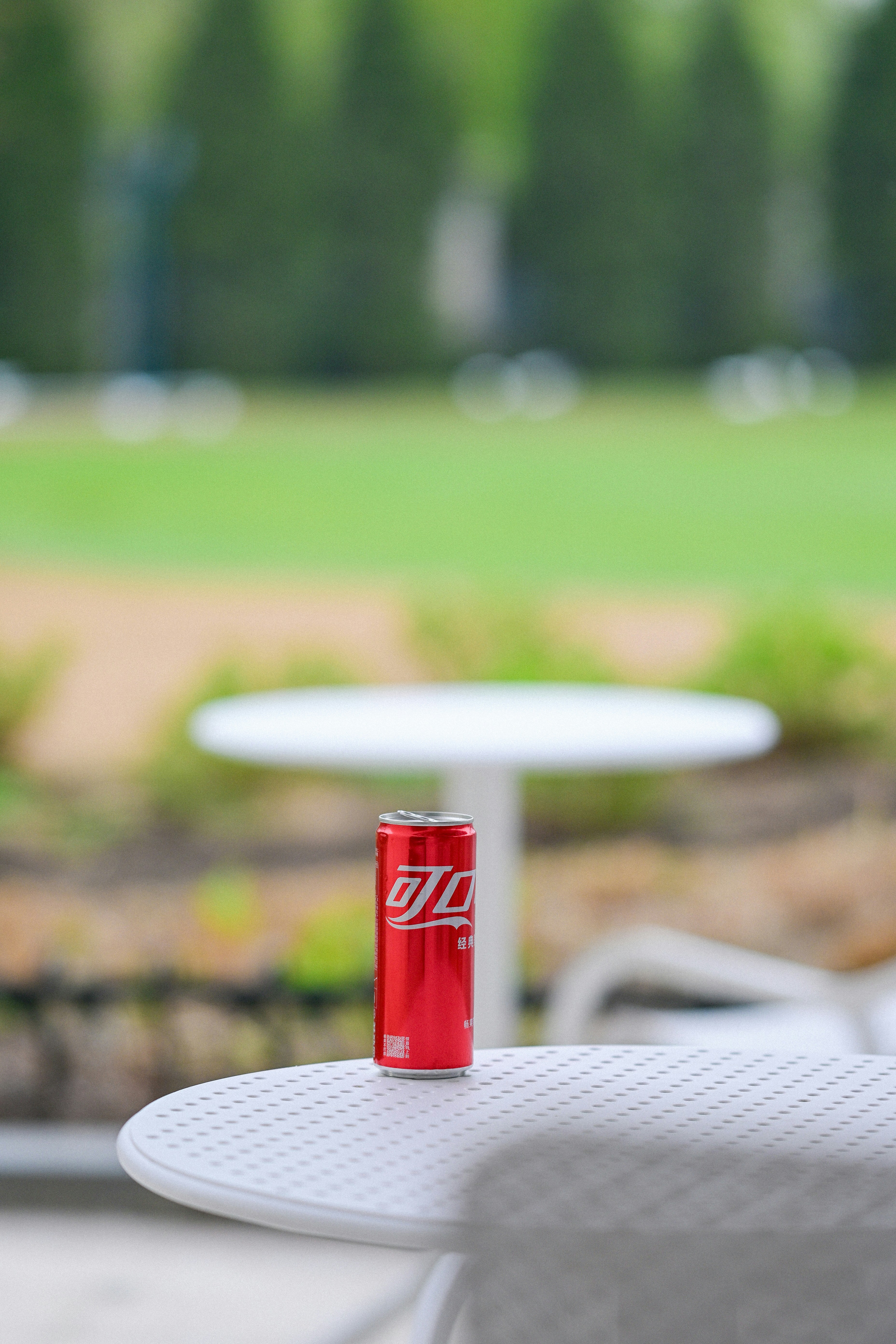 Red Soda Can on a Quiet Outdoor Table