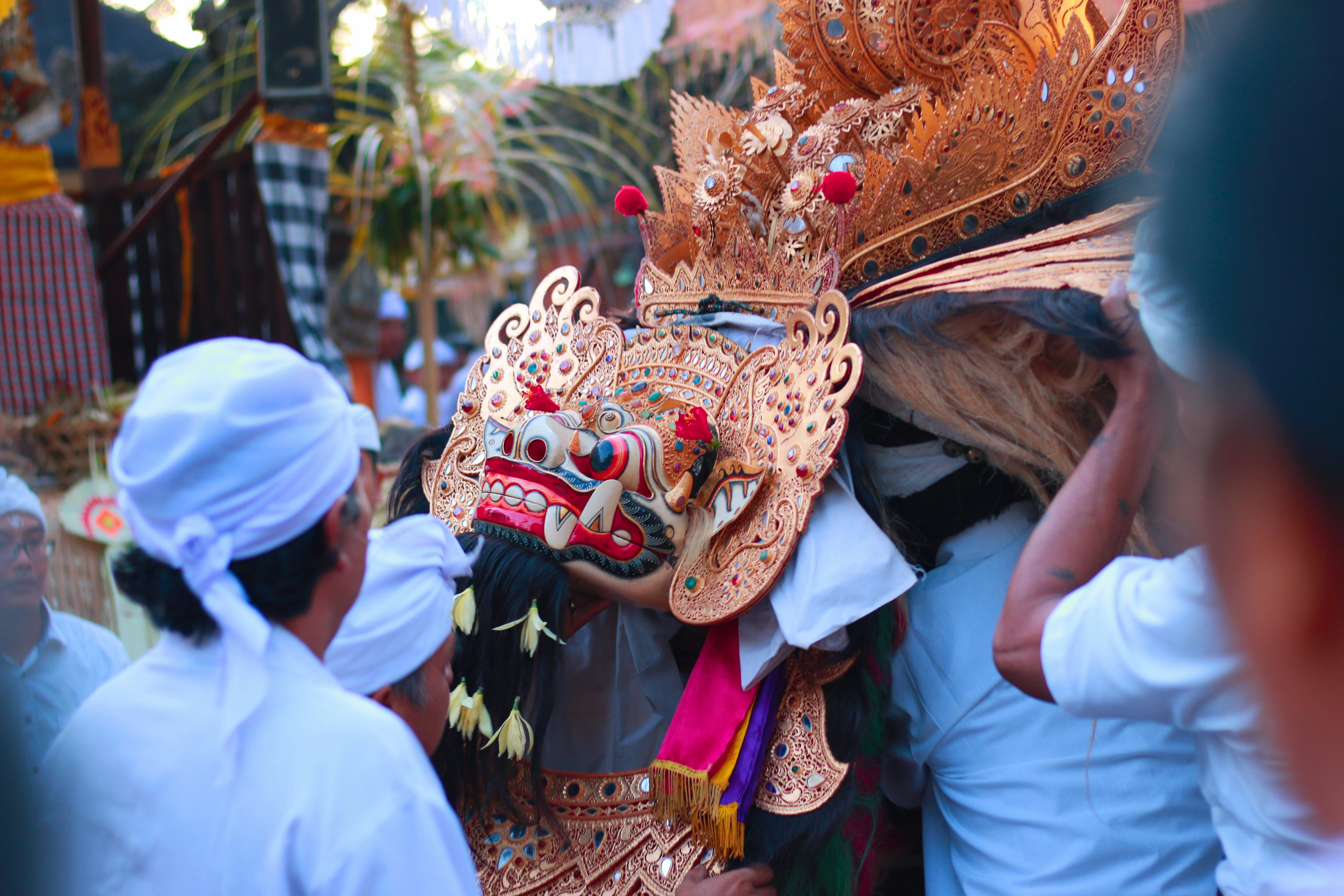 Mask and Ceremony: A Sacred Dragon's Gaze among White-clad Followers