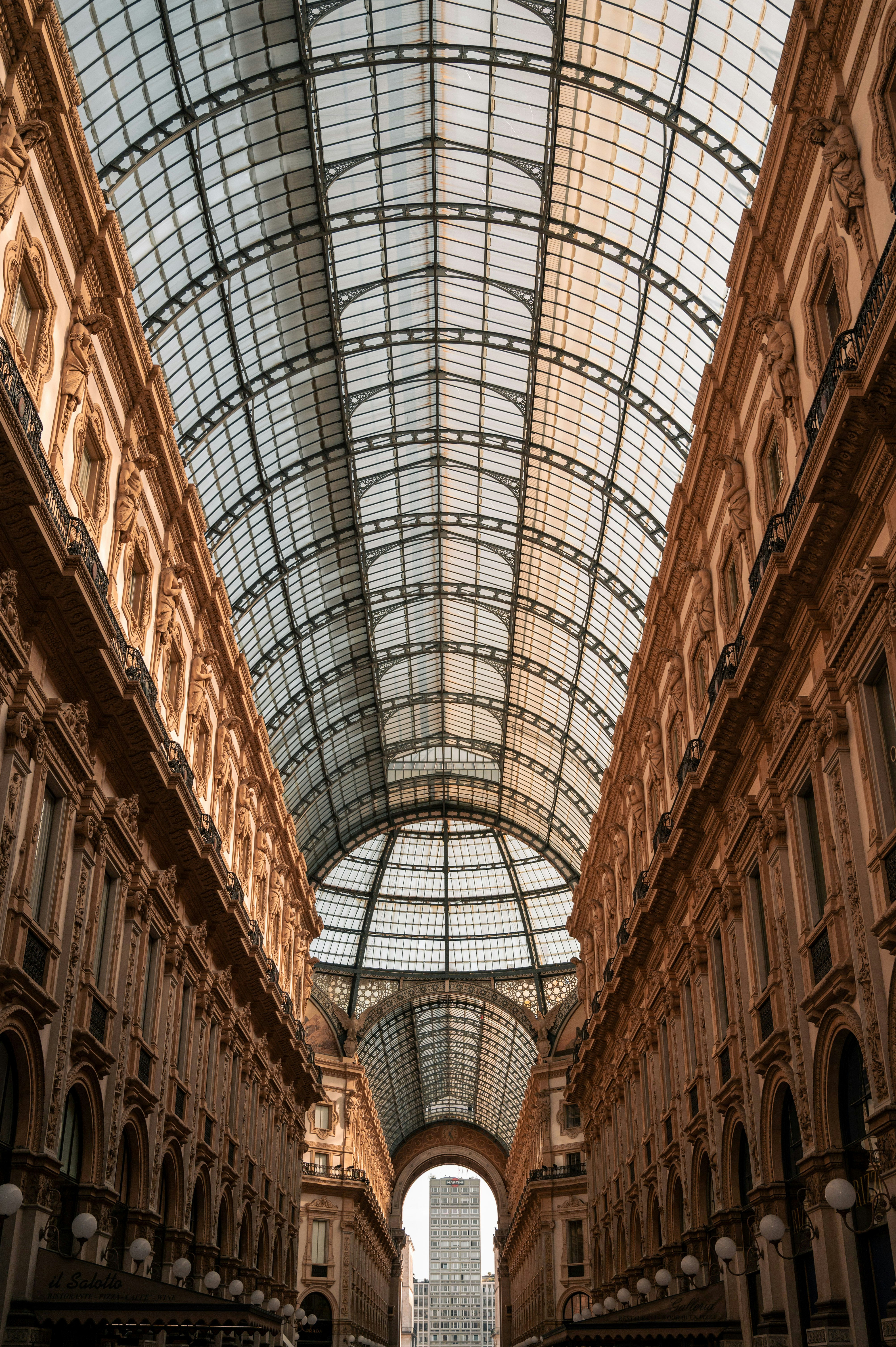 Glass-Cky Archway: A Grand Indoor Alley Framed by Ribboned Steel and Stone