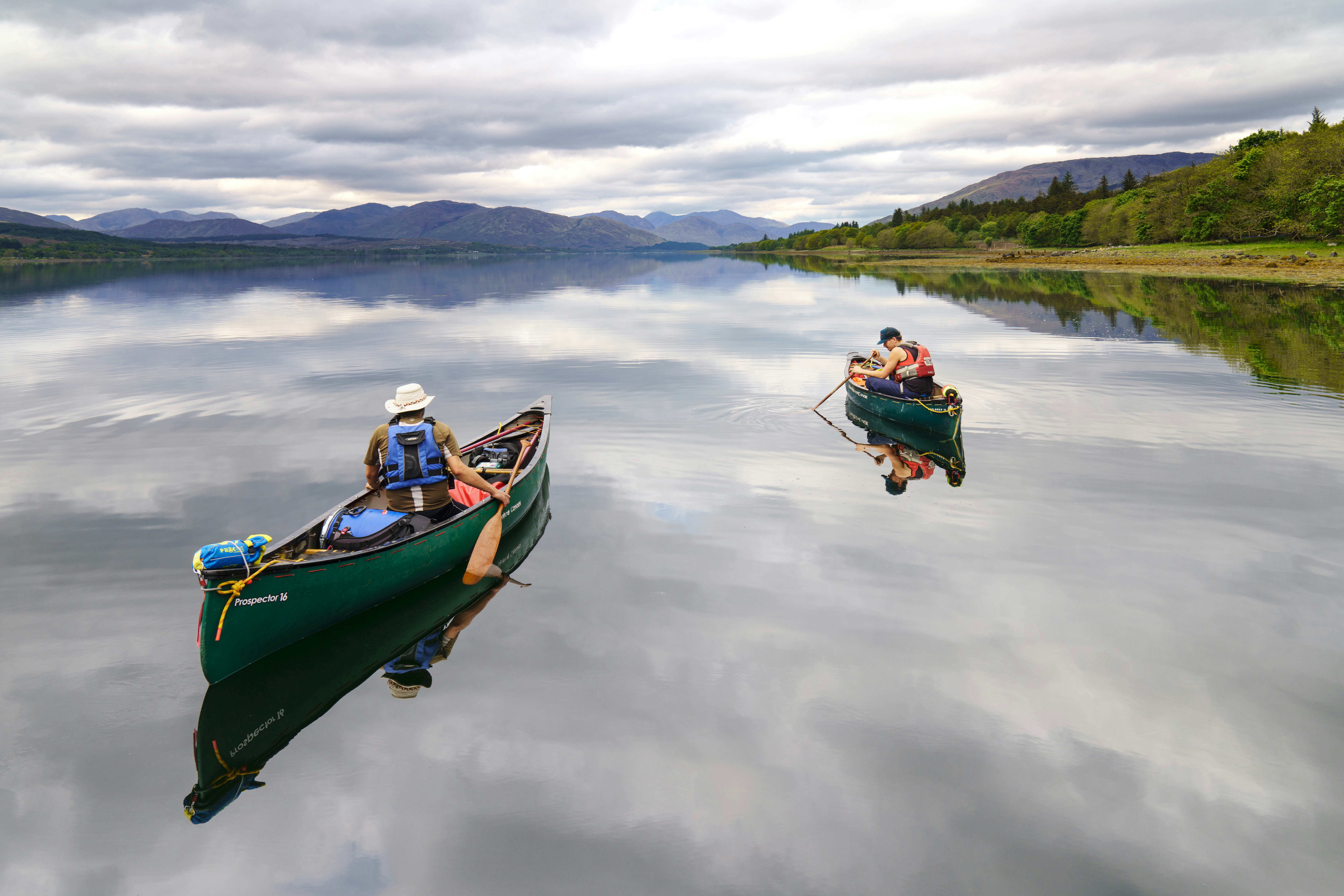 Twin Explorers on a Glassy Lake