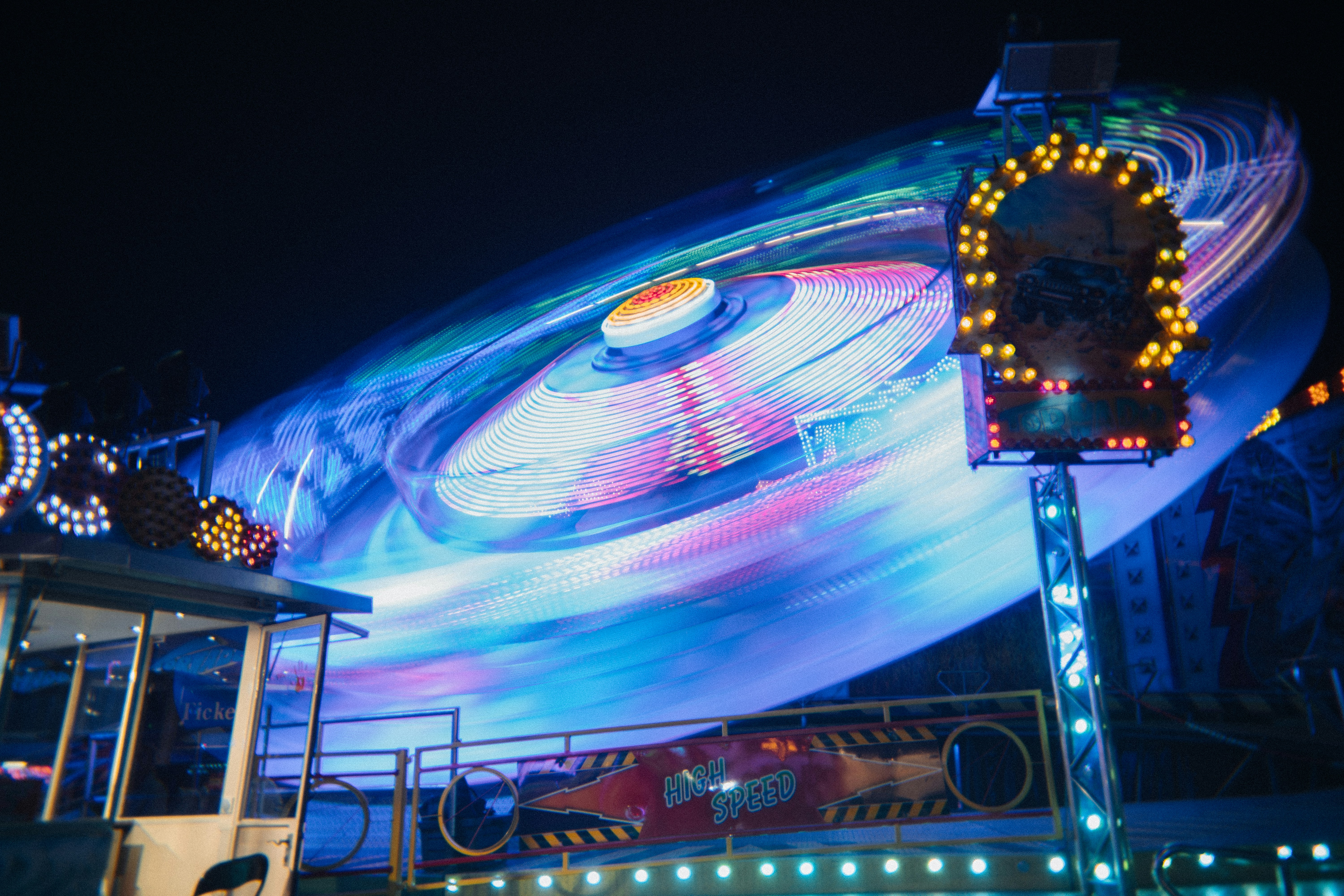 Luminescent Whirl: Night Ride of Neon Rings