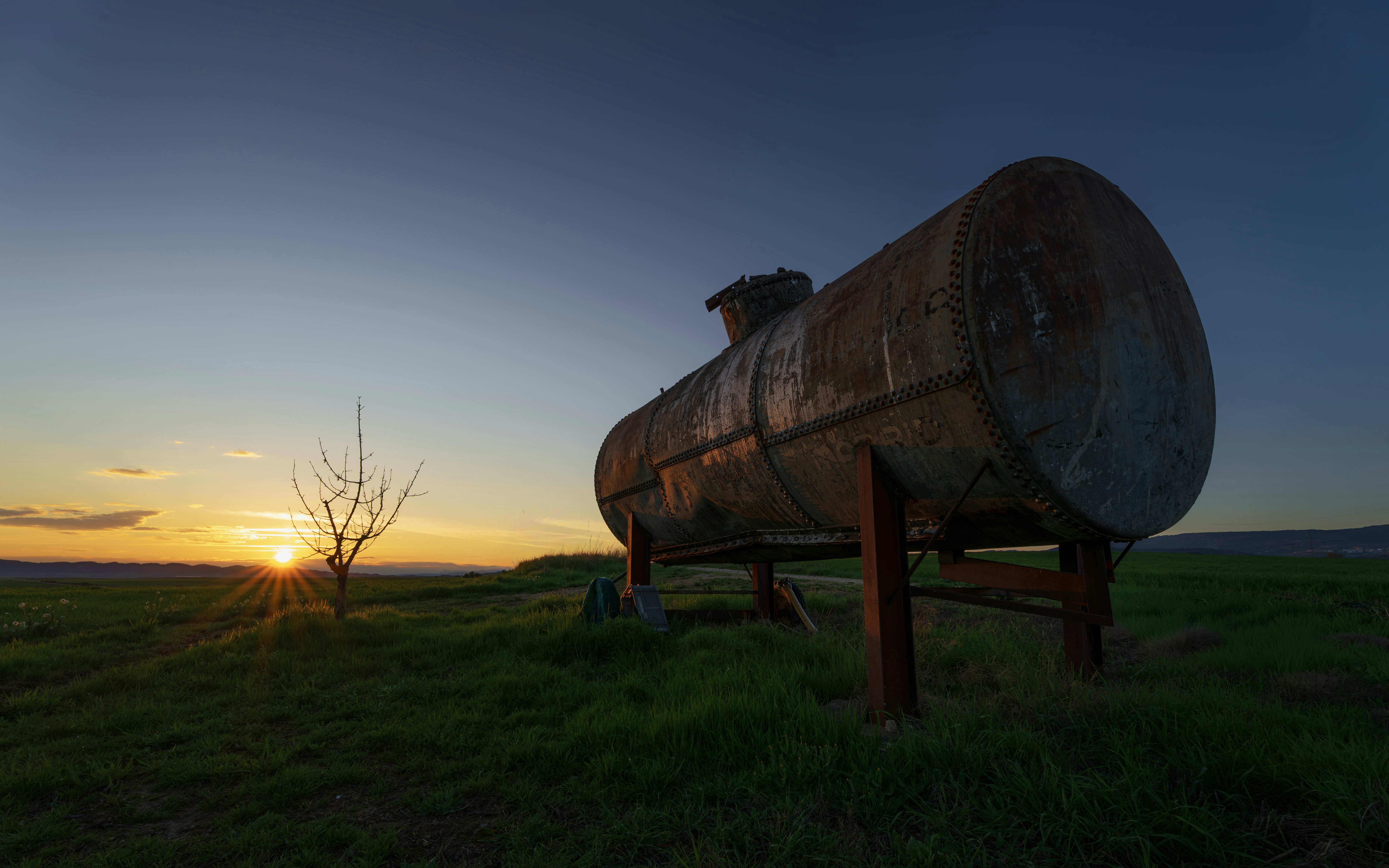 Rust and Dusk: A Tanker Silhouette at the Edge of Light