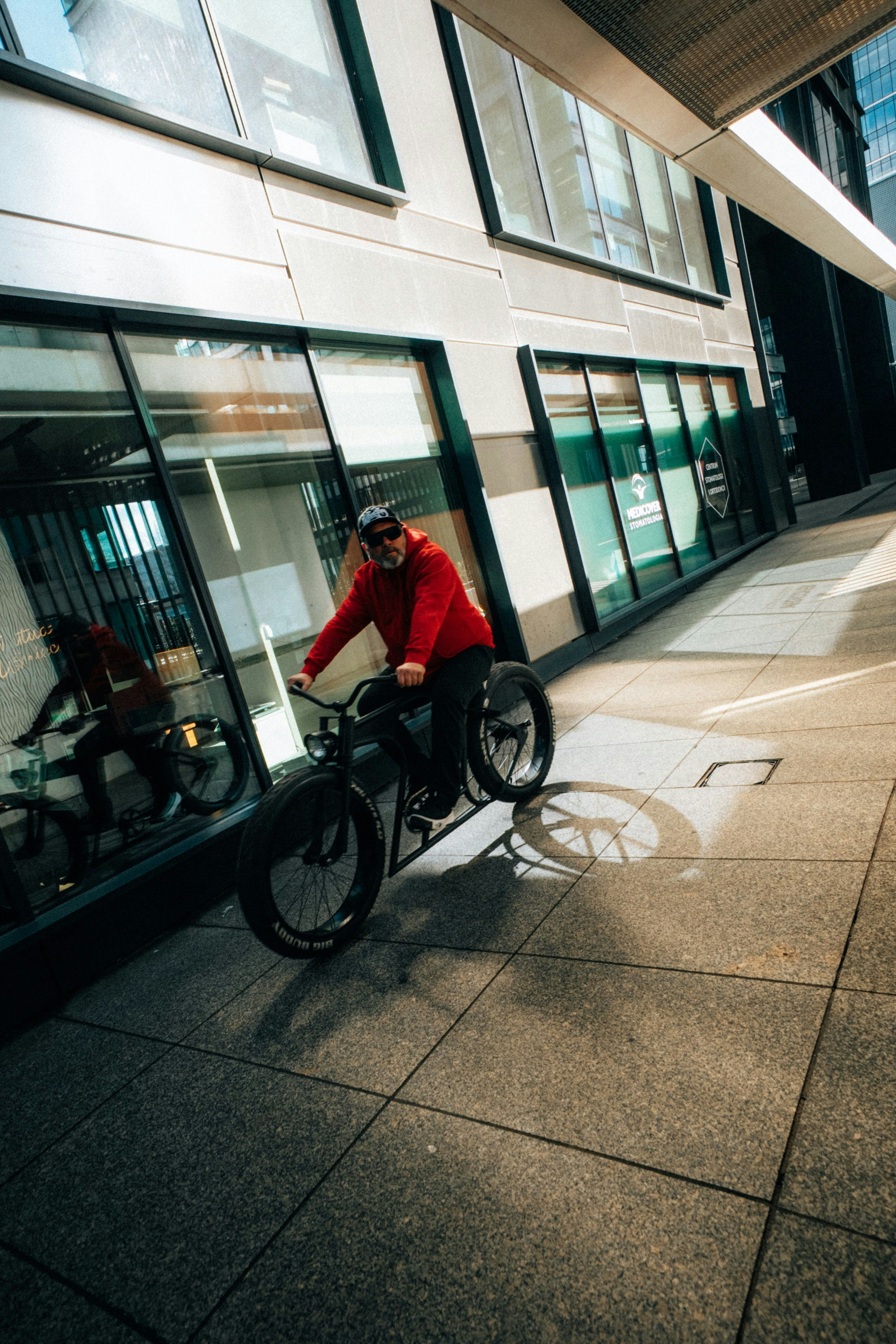 Red-Jacket Cyclist in Citycanopy