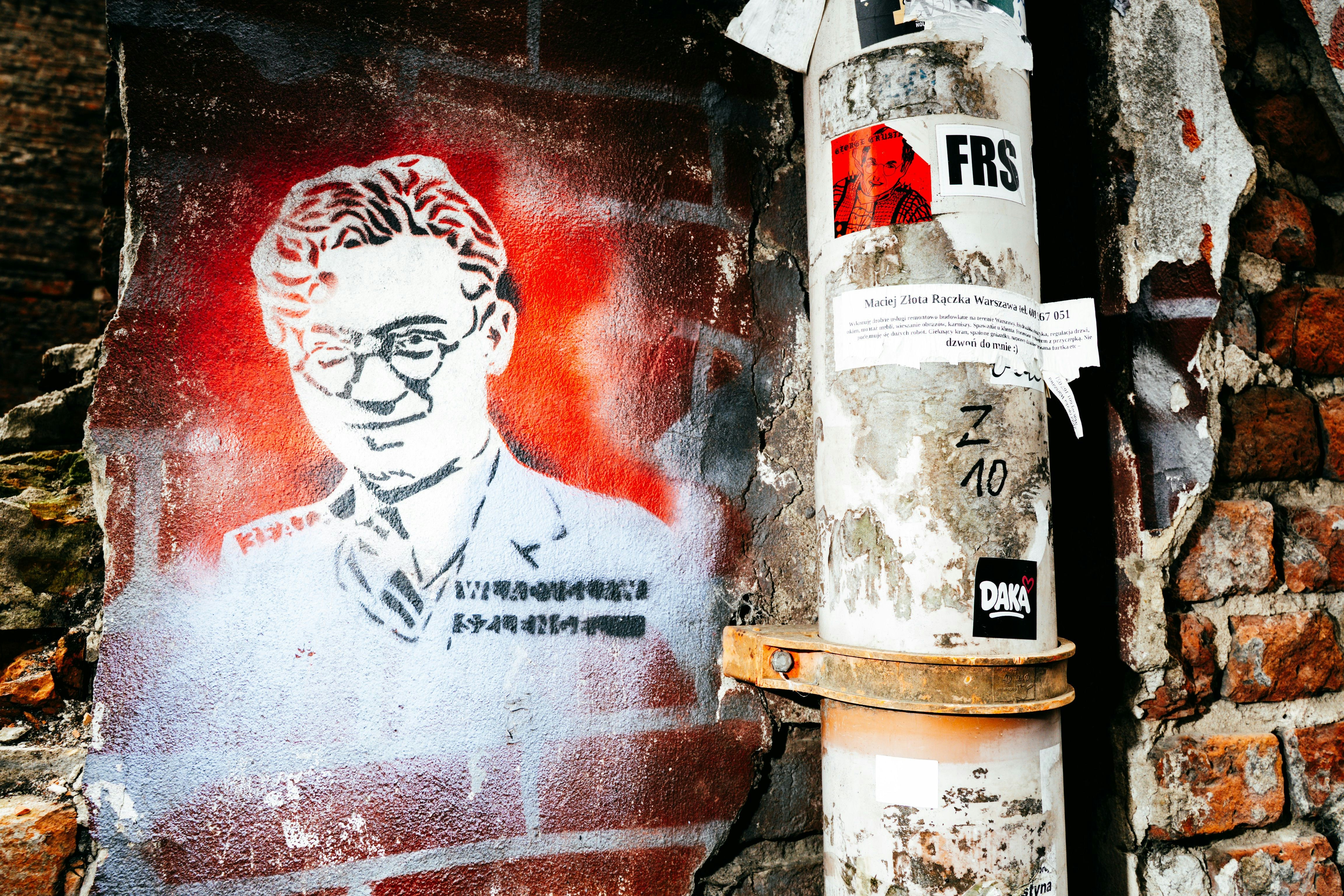 Stenciled Portrait by the Wall: A Weathered Urban Collage