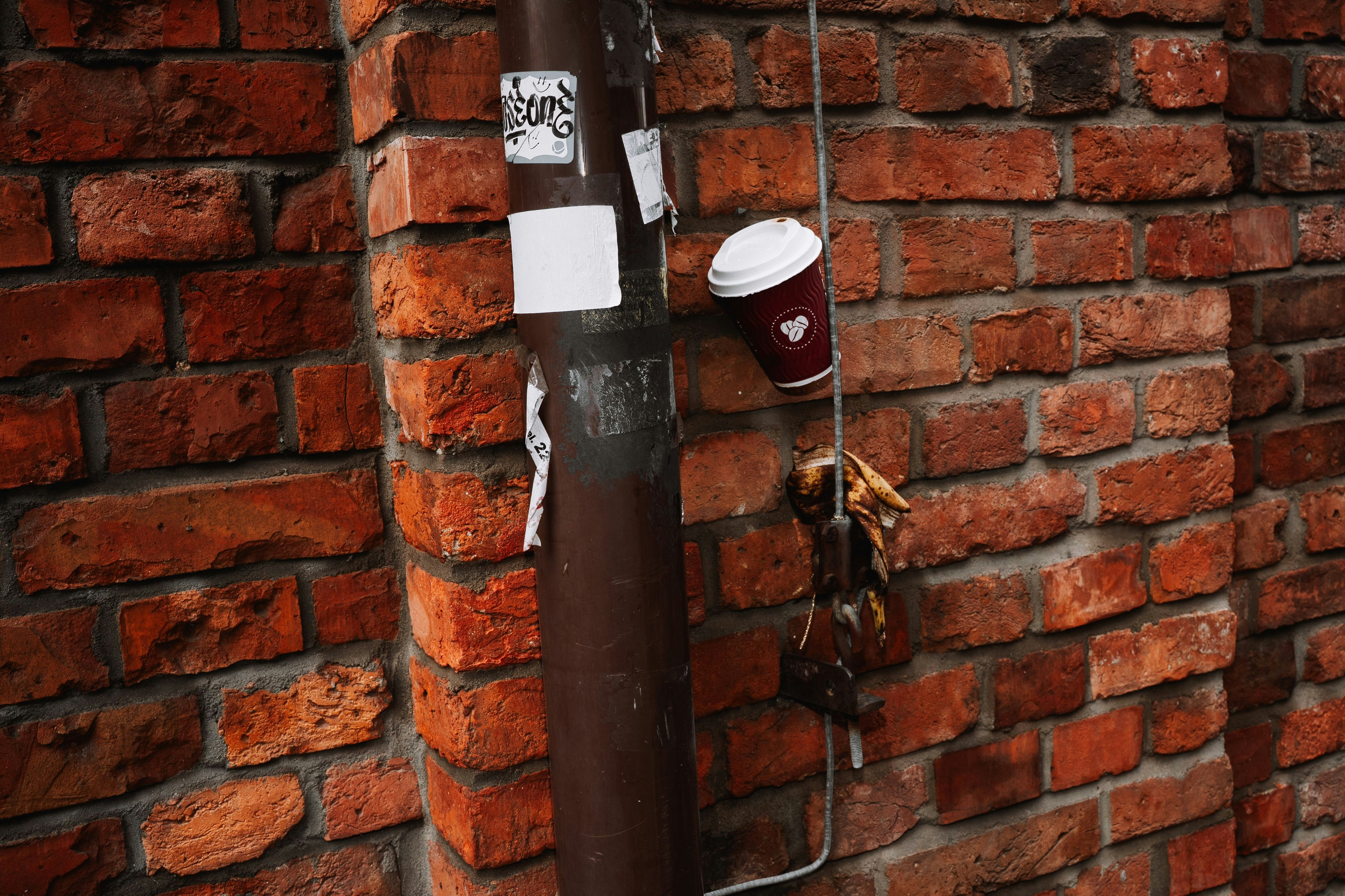 Coffee-stained Lifeline on a Brick Corner