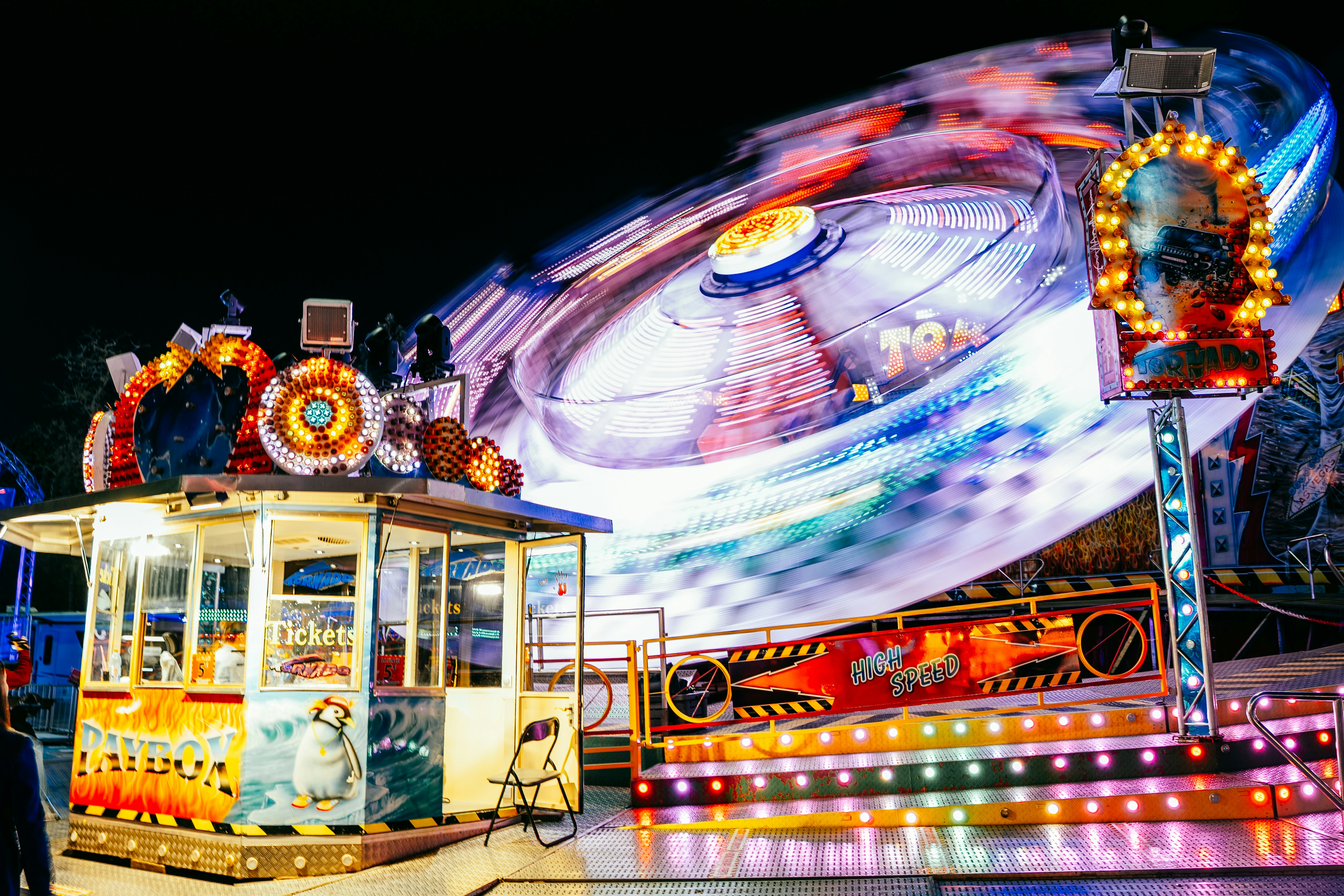 Spin of Color: Night Carousel at the Carnival Booth
