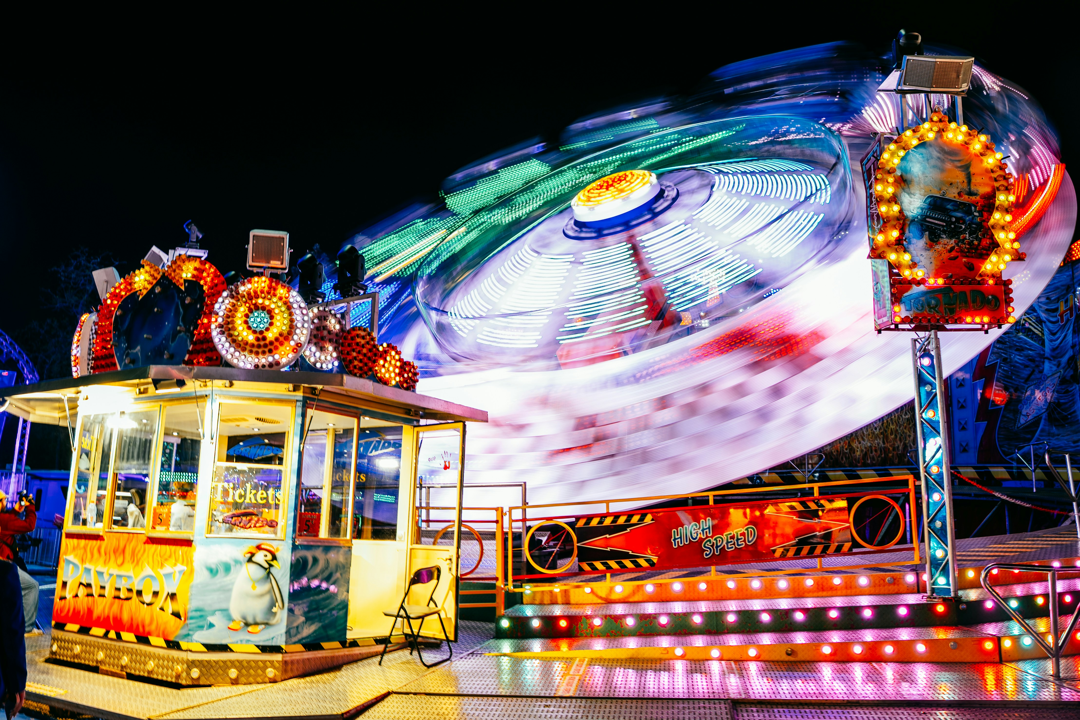 Spin of Light: Night Carousel Whirl at the Ticket Booth